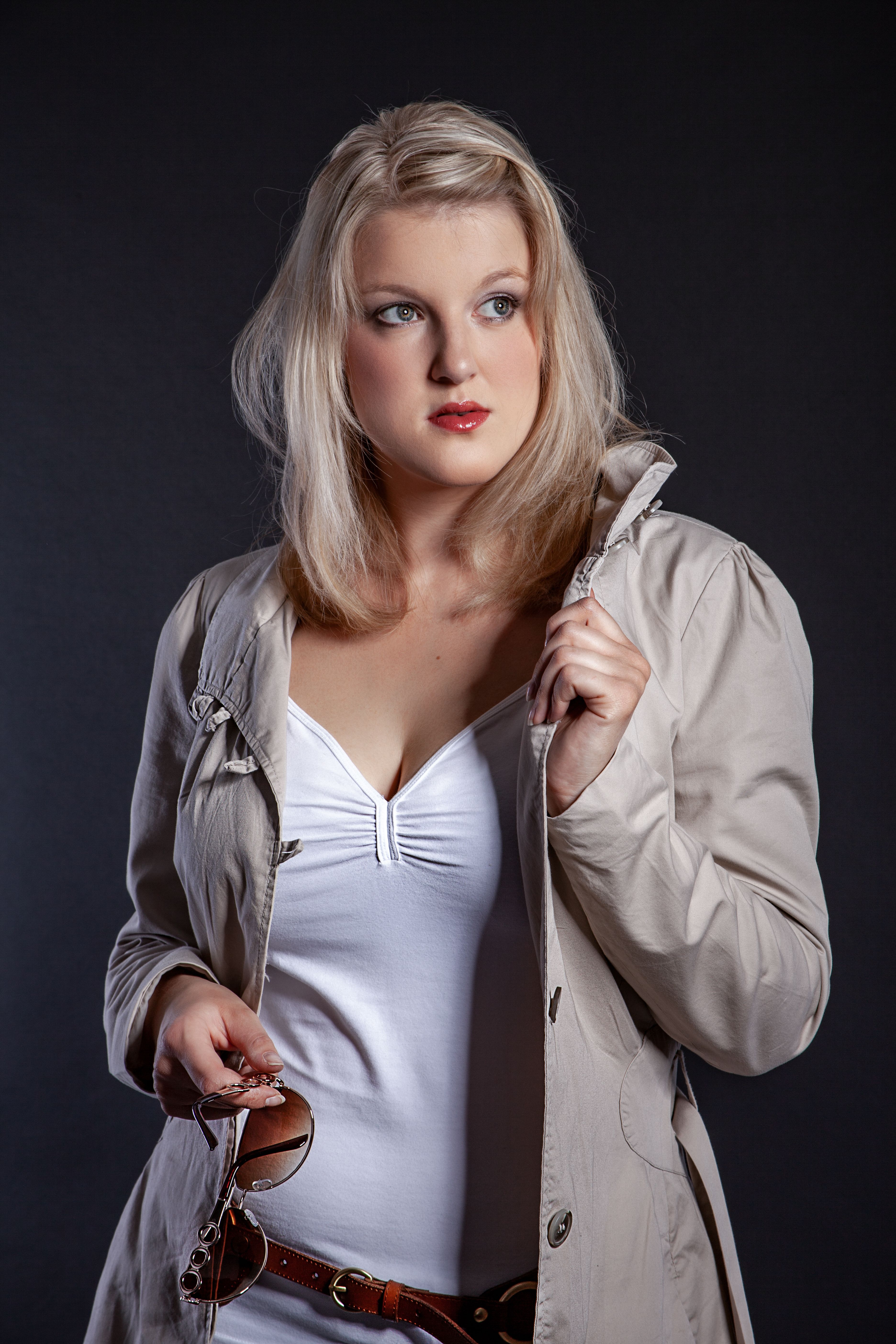 Portrait of a Young Woman in a Brown Coat Standing Outside · Free Stock ...