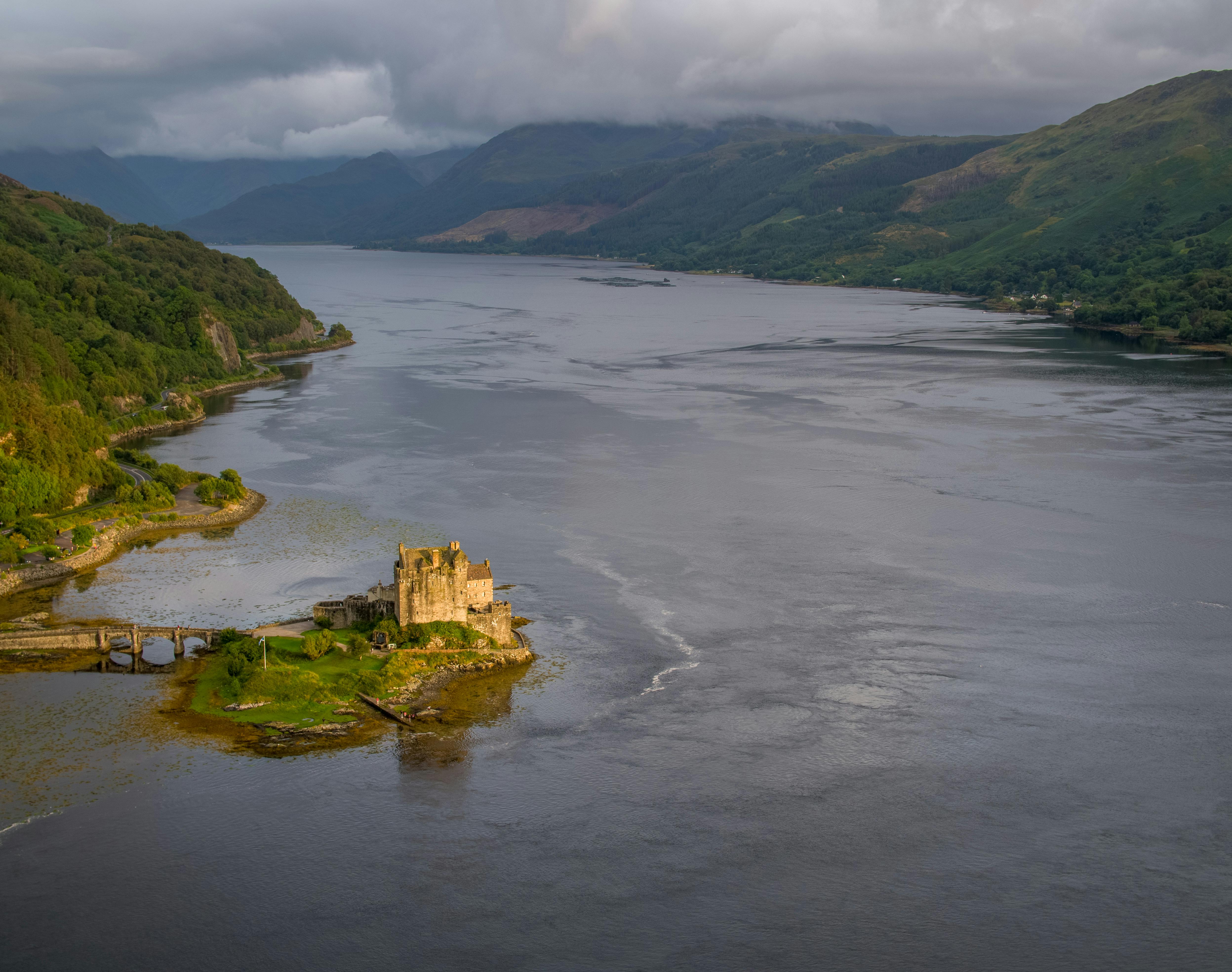An Aerial Shot of a Castle on a Lake · Free Stock Photo
