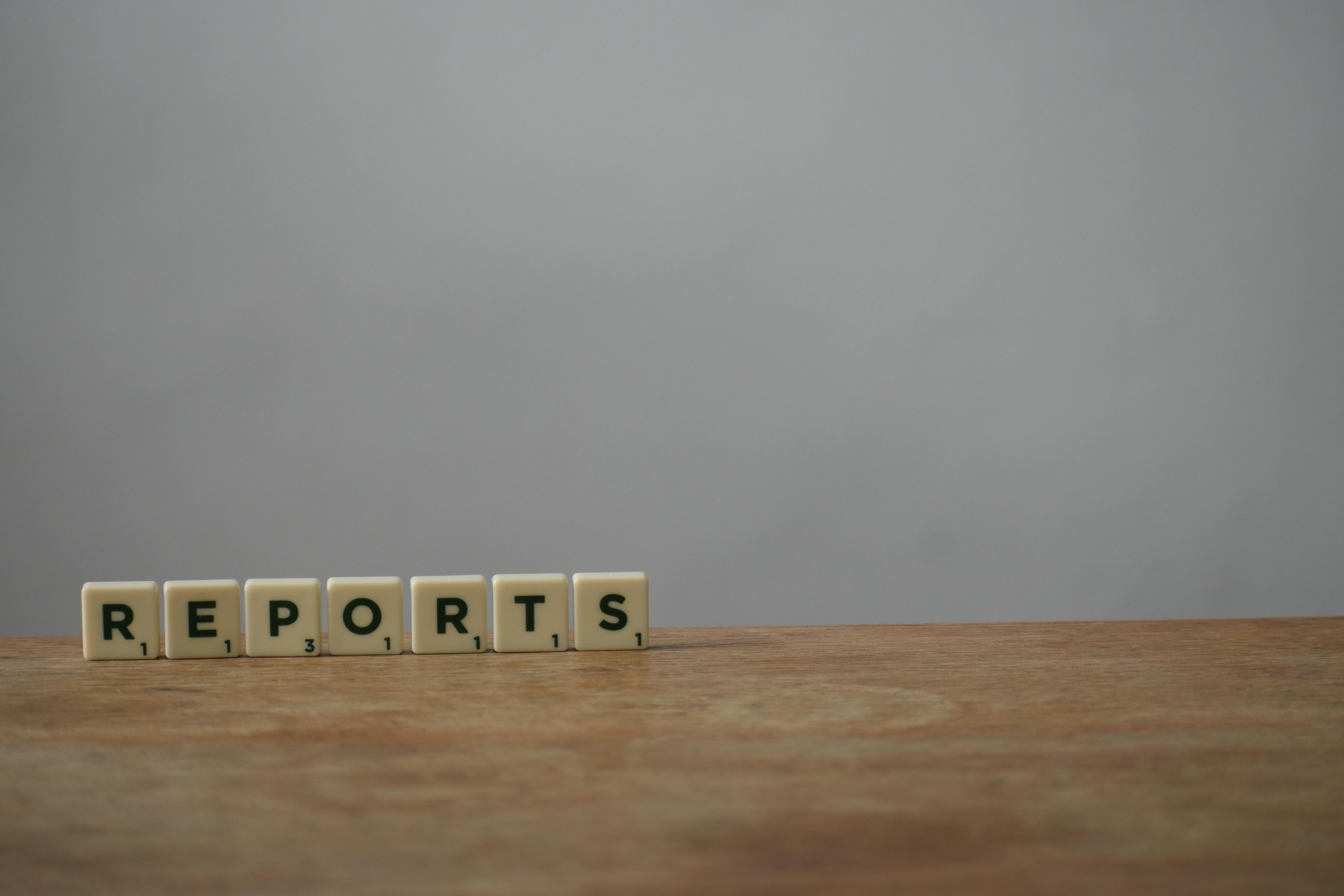 Scrabble Letters on Wooden Desk · Free Stock Photo