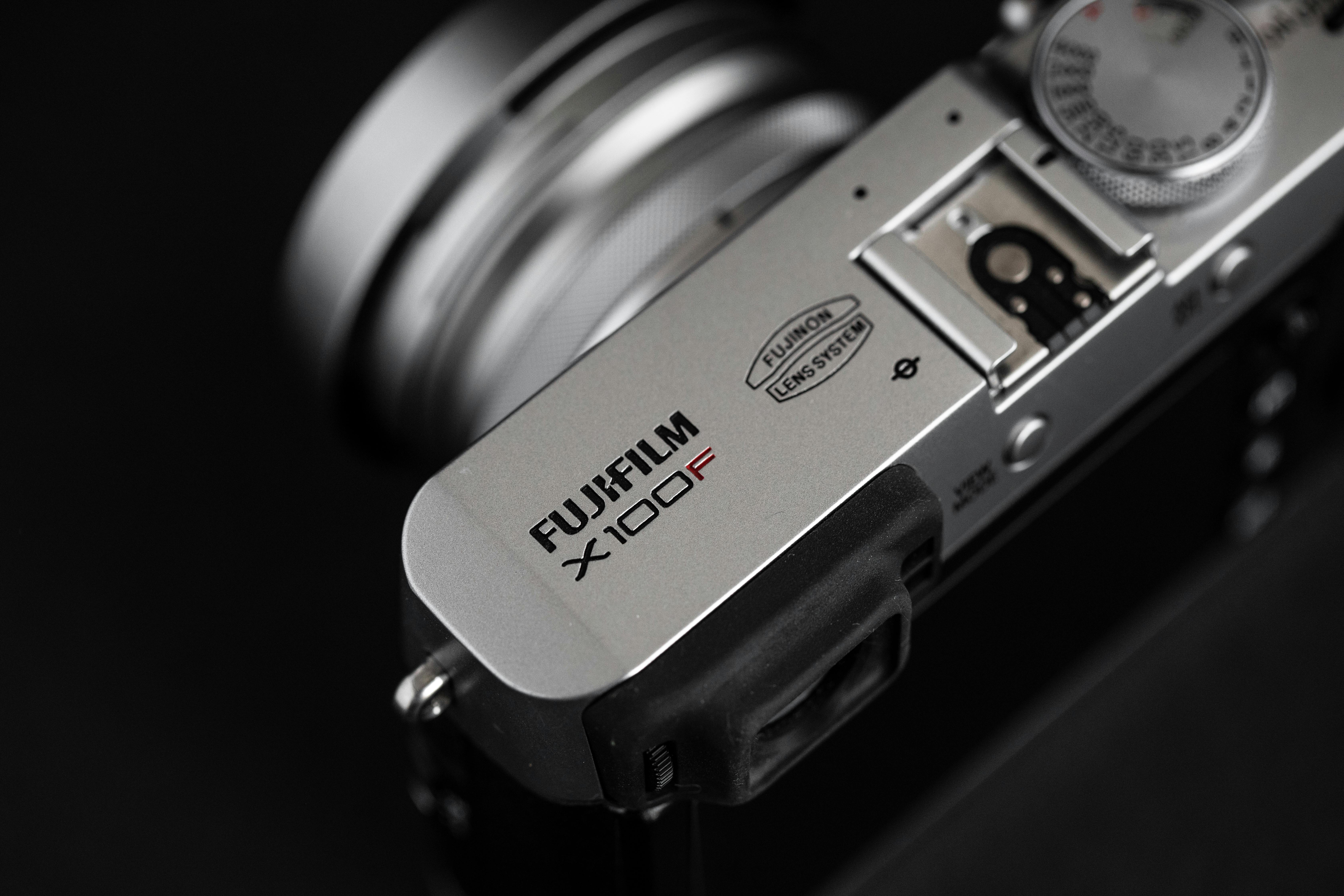 Black and Silver Film Camera on Brown Wooden Surface · Free Stock Photo