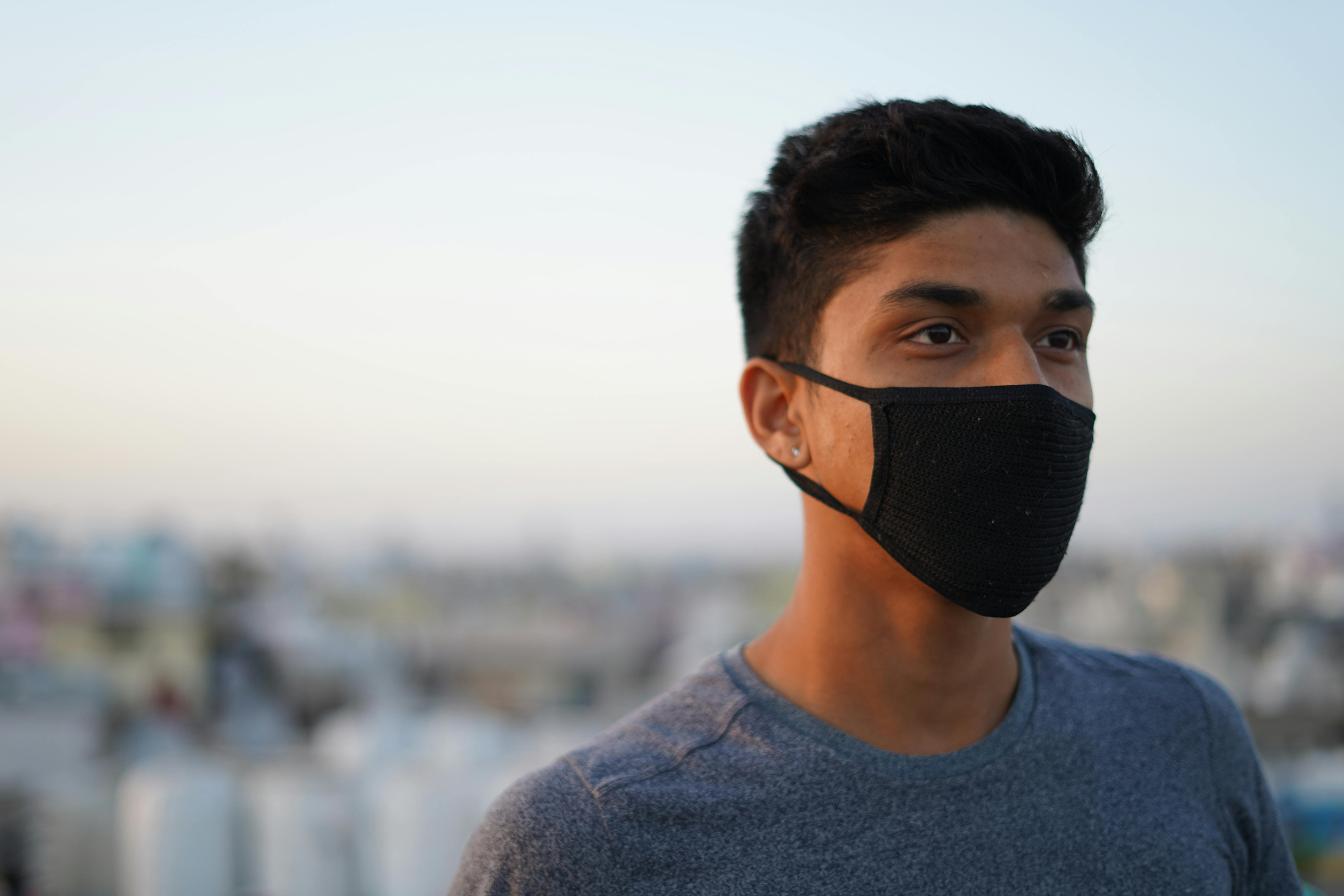 A Person Wearing Black Face Mask · Free Stock Photo