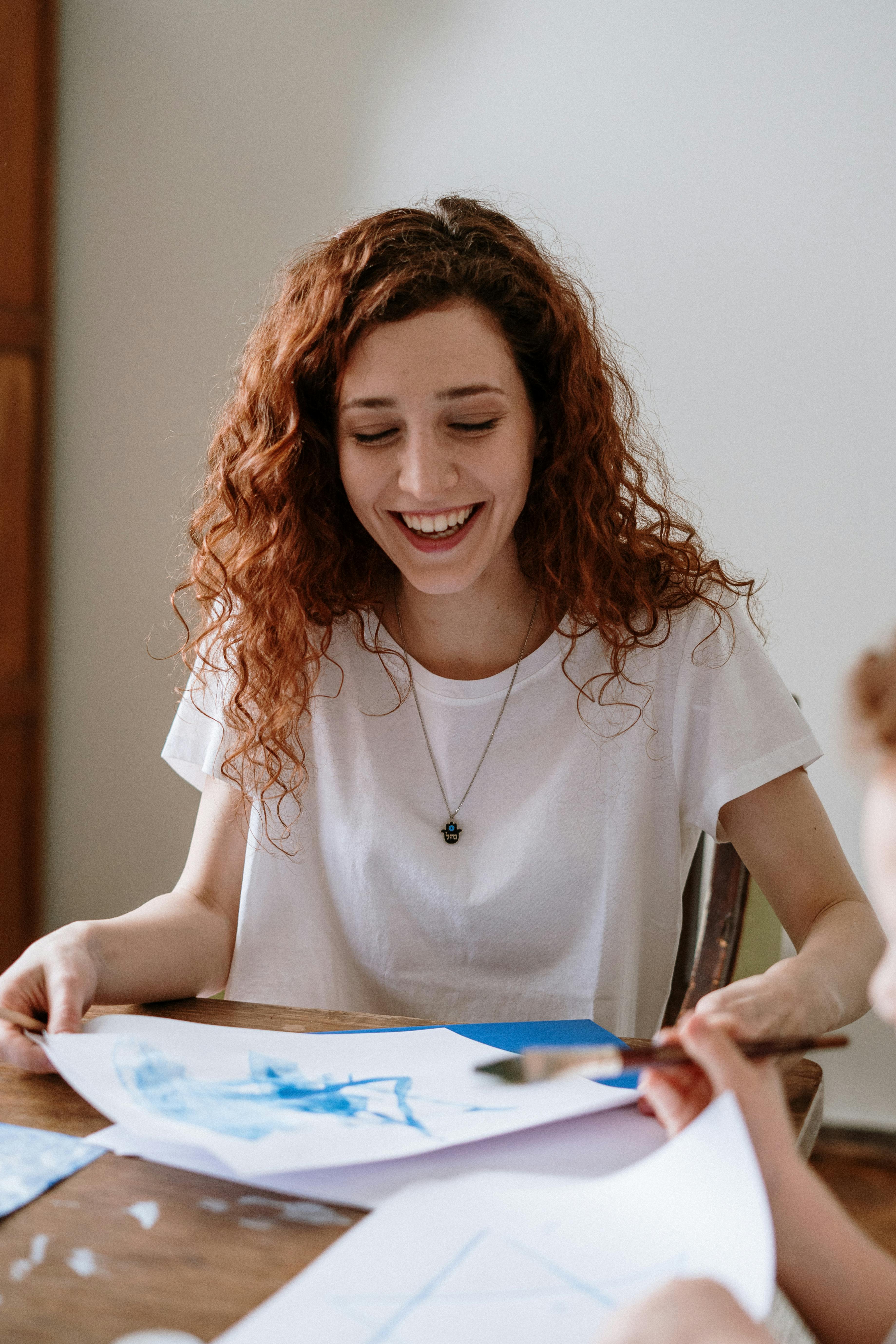 Woman Looking at a Drawing · Free Stock Photo