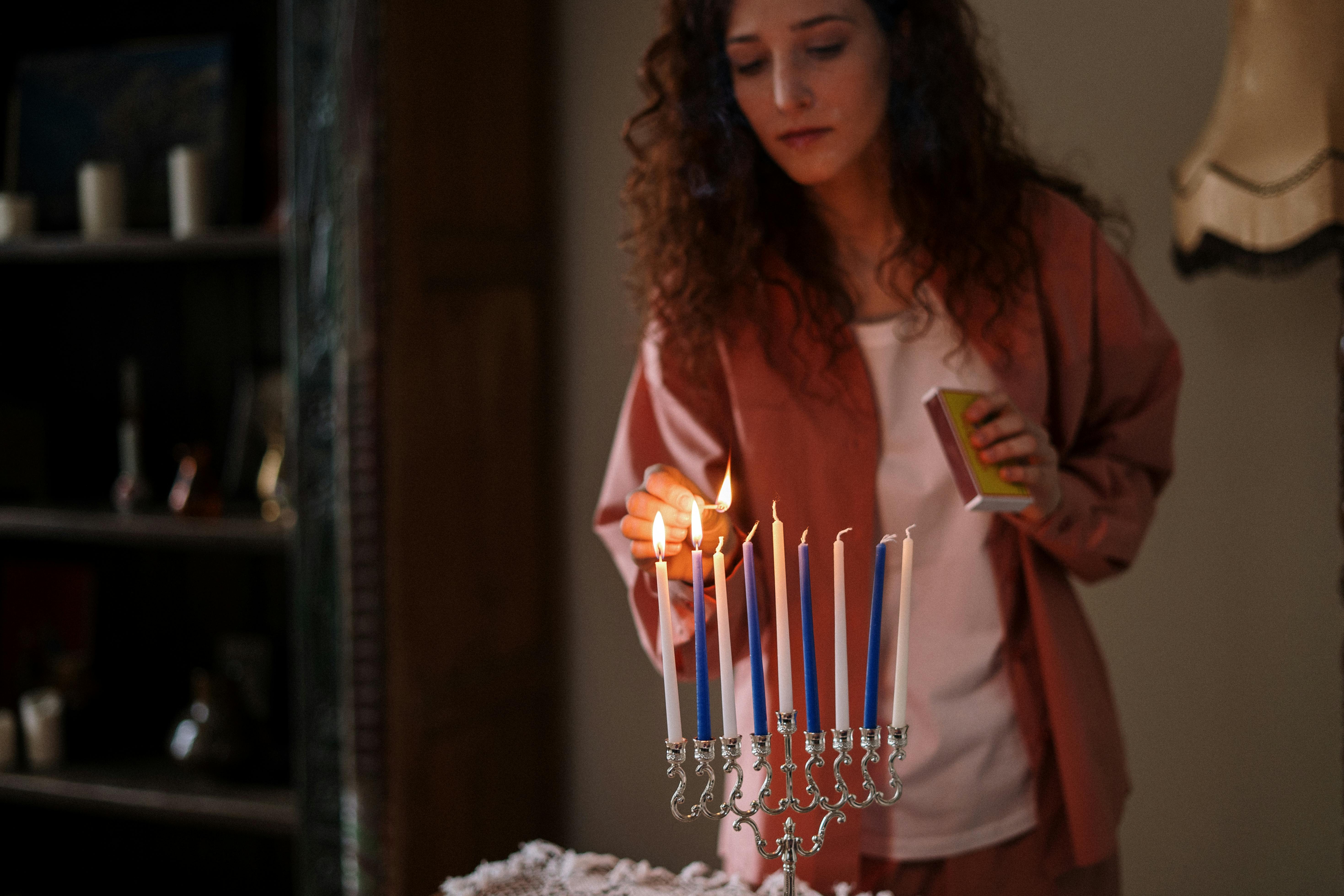 Woman Lighting up Candles · Free Stock Photo