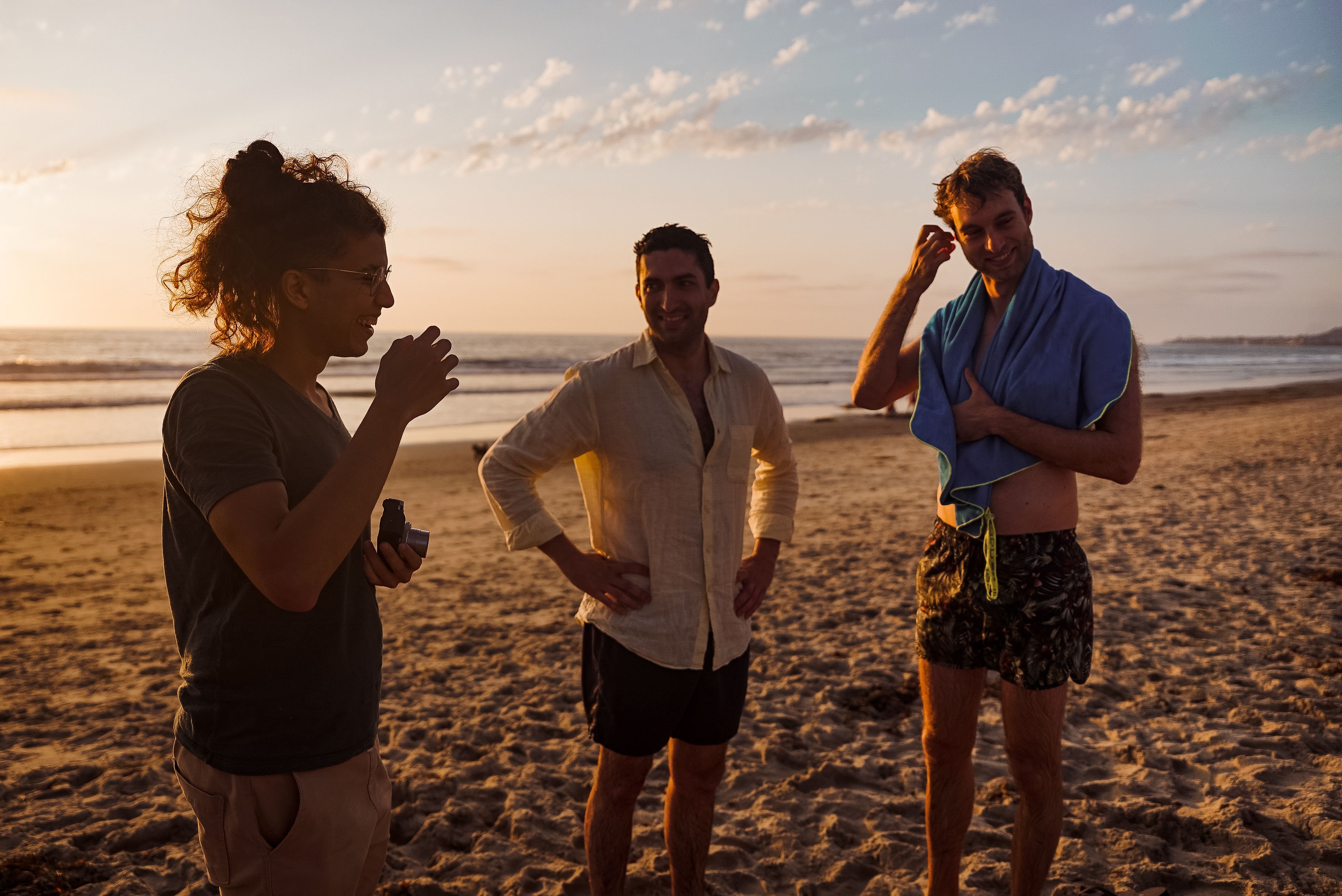 People Standing On A Sandy Beach · Free Stock Photo