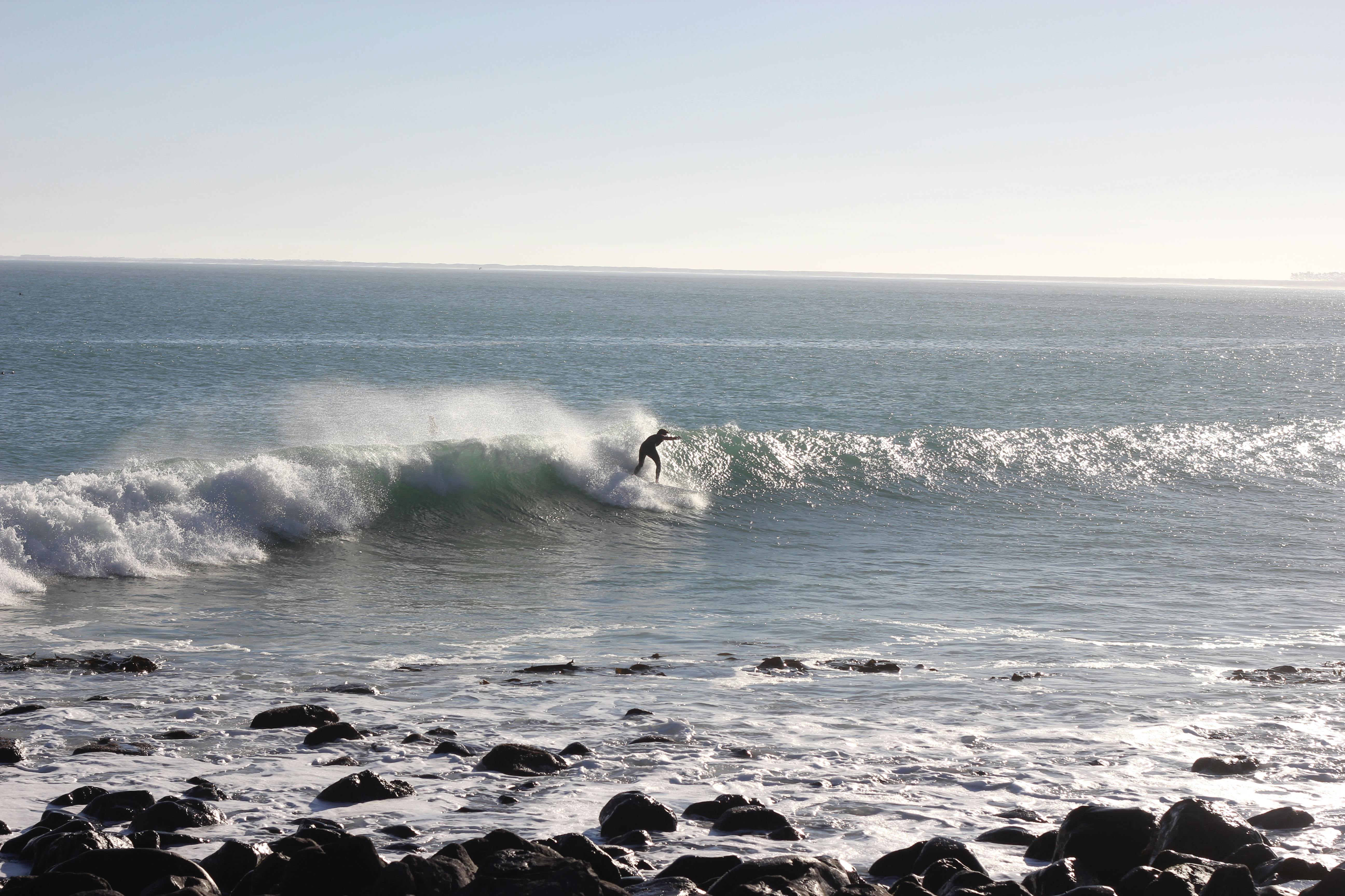 Person Doing Surfing On Sea Waves · Free Stock Photo