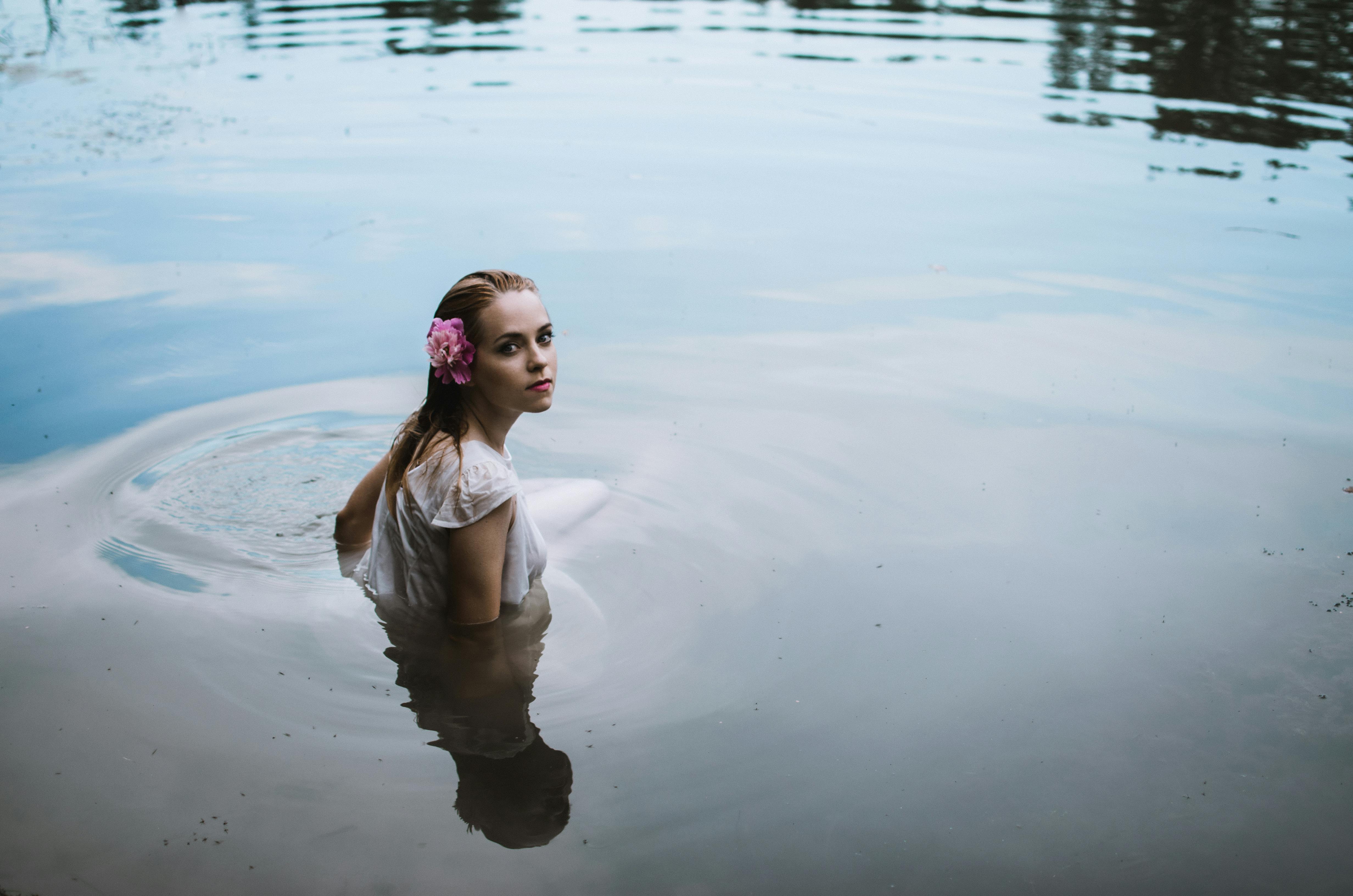 Photography of a Woman On Water · Free Stock Photo