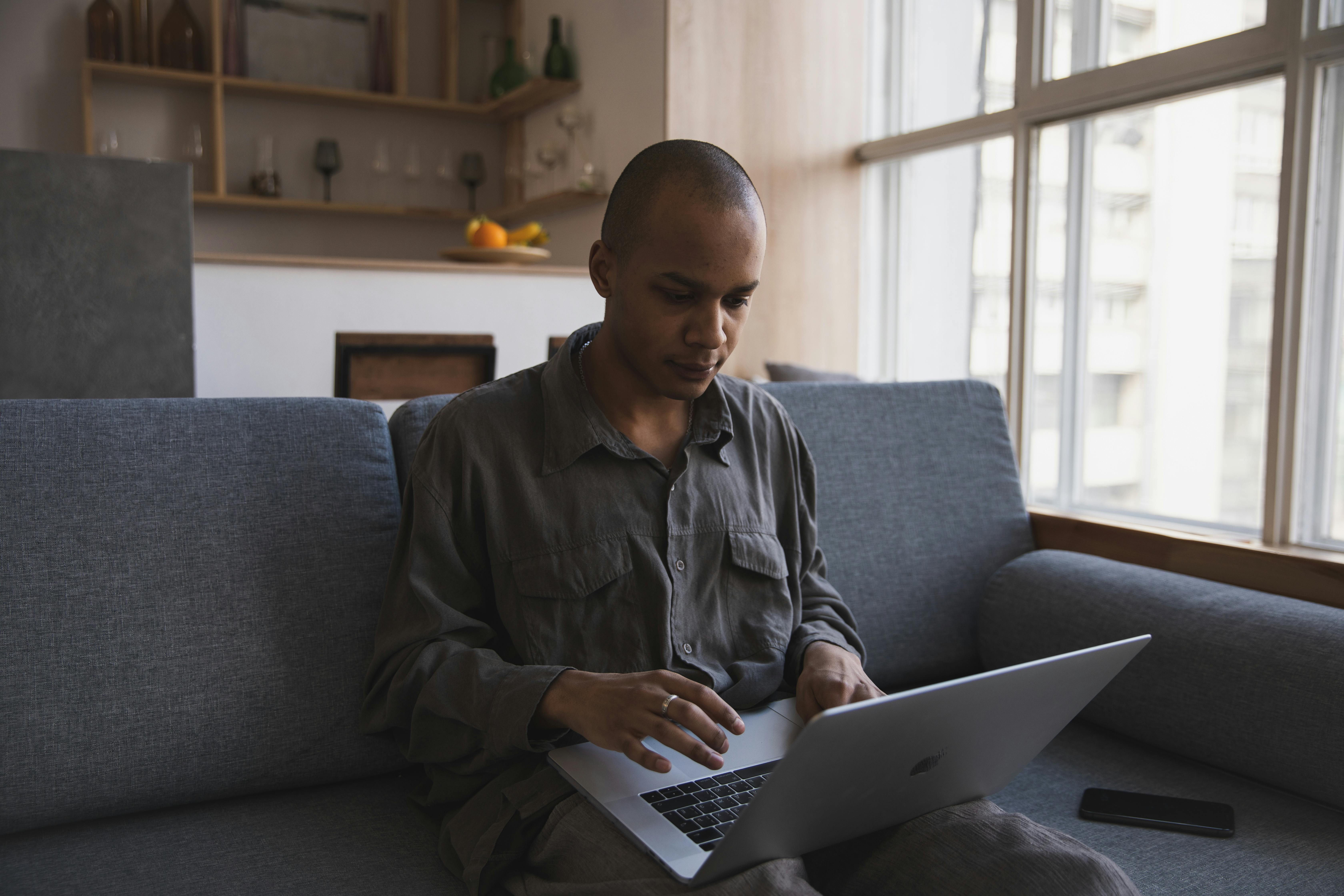 Photo Of Man Using Laptop · Free Stock Photo