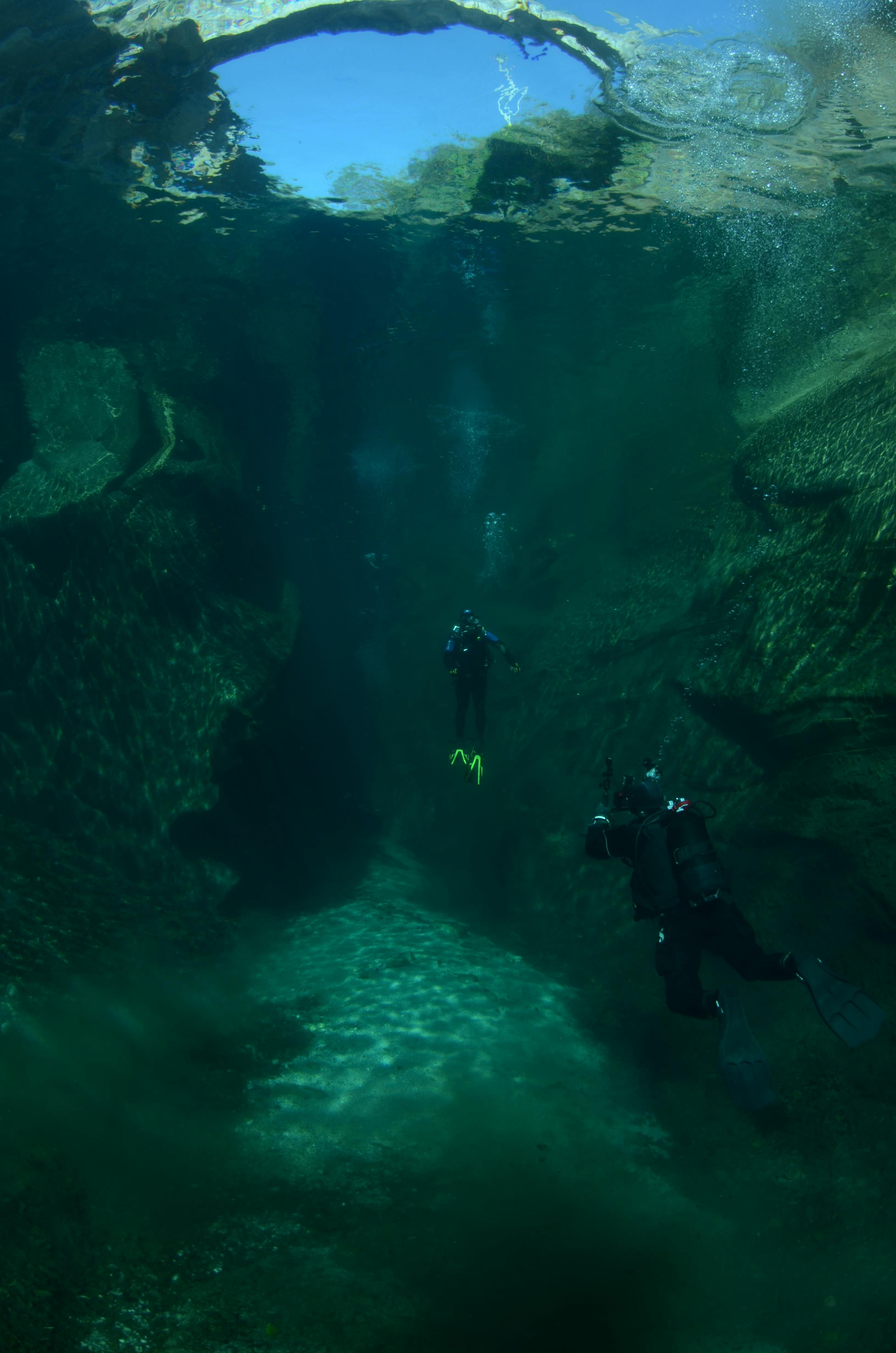 Person Scuba Diving Underwater Deep Sea Water · Free Stock Photo