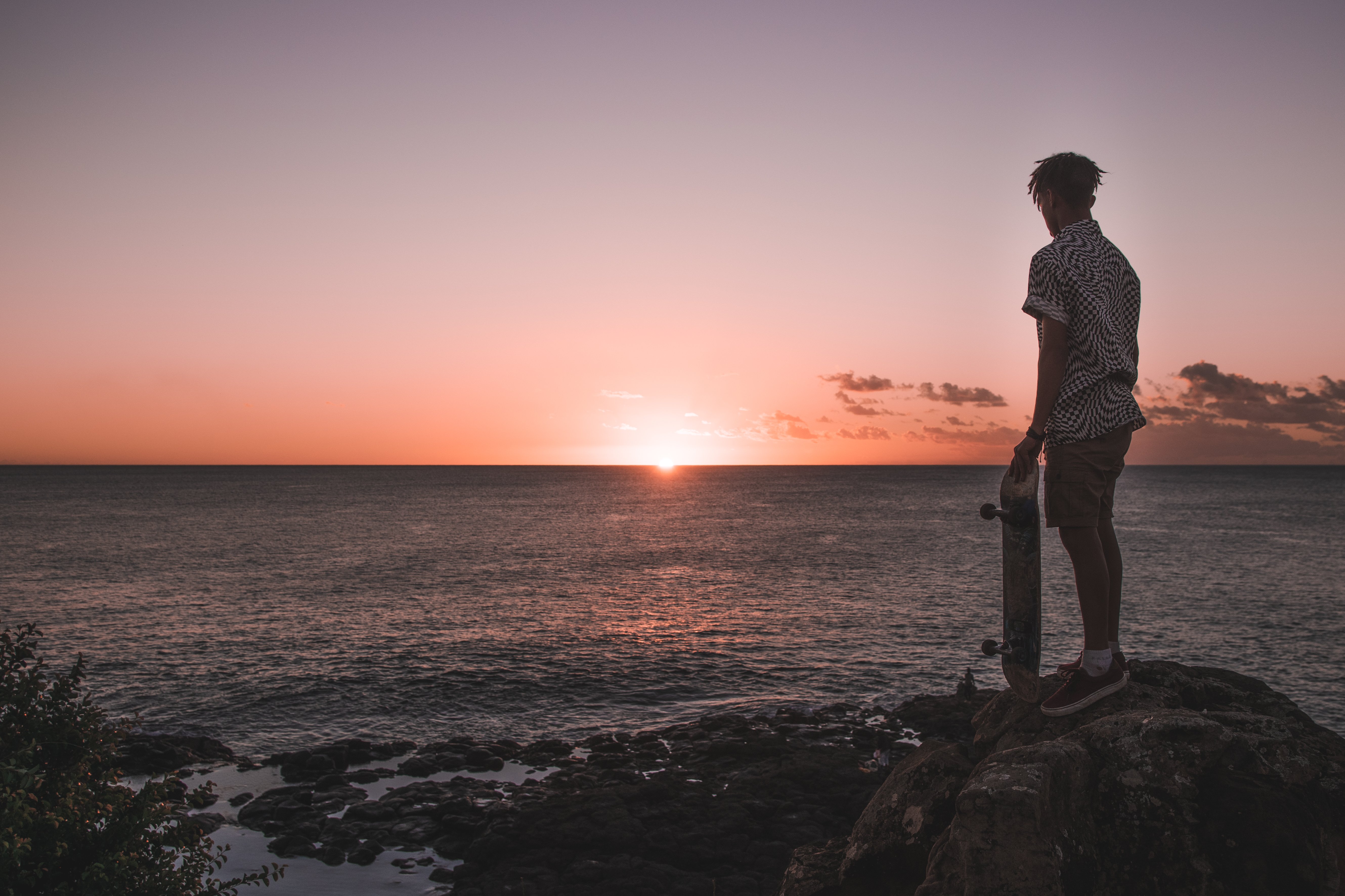 Man Standing on Tree Branch during Sunset · Free Stock Photo