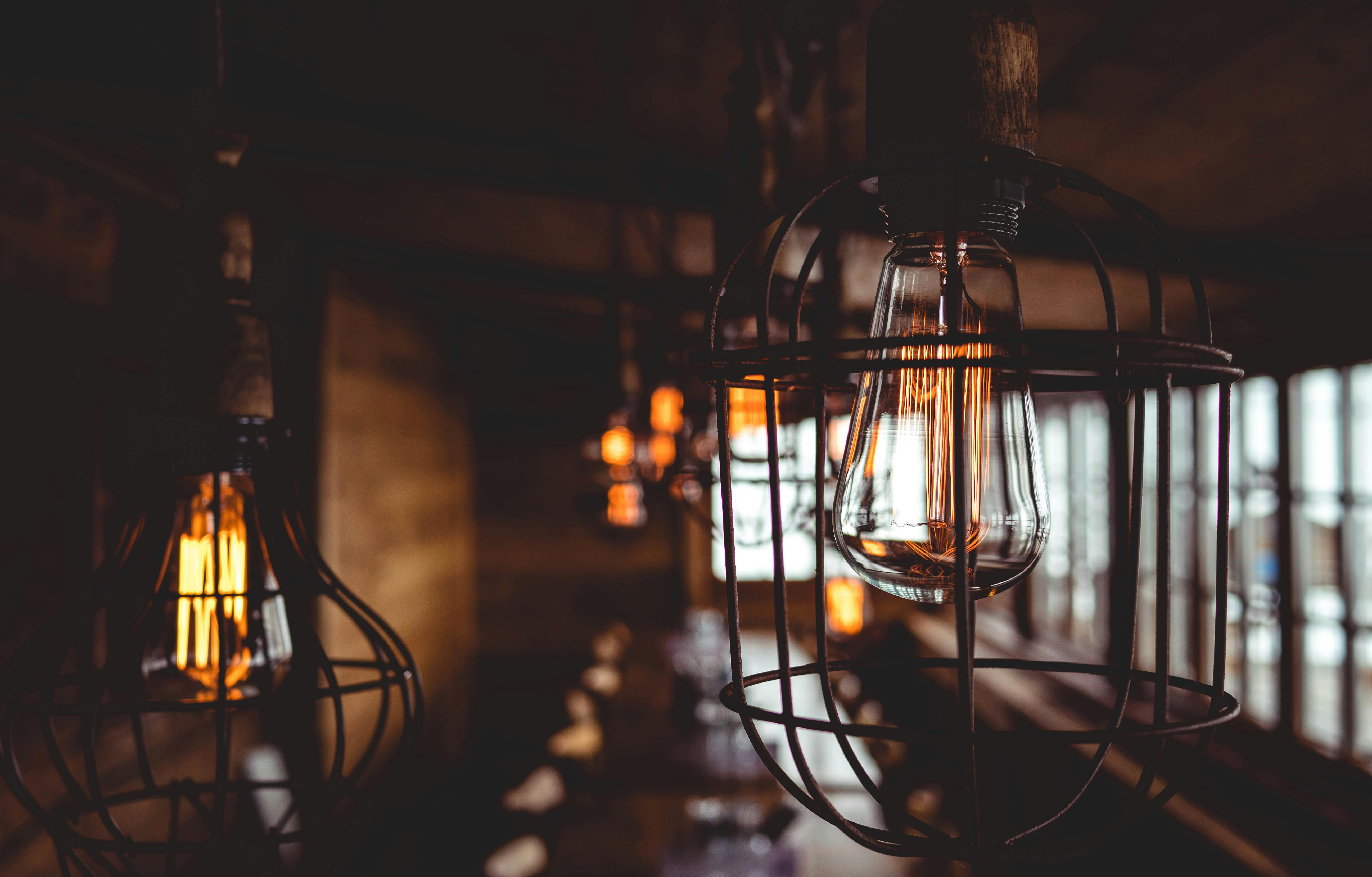 Light bulb hanging on rope in studio · Free Stock Photo