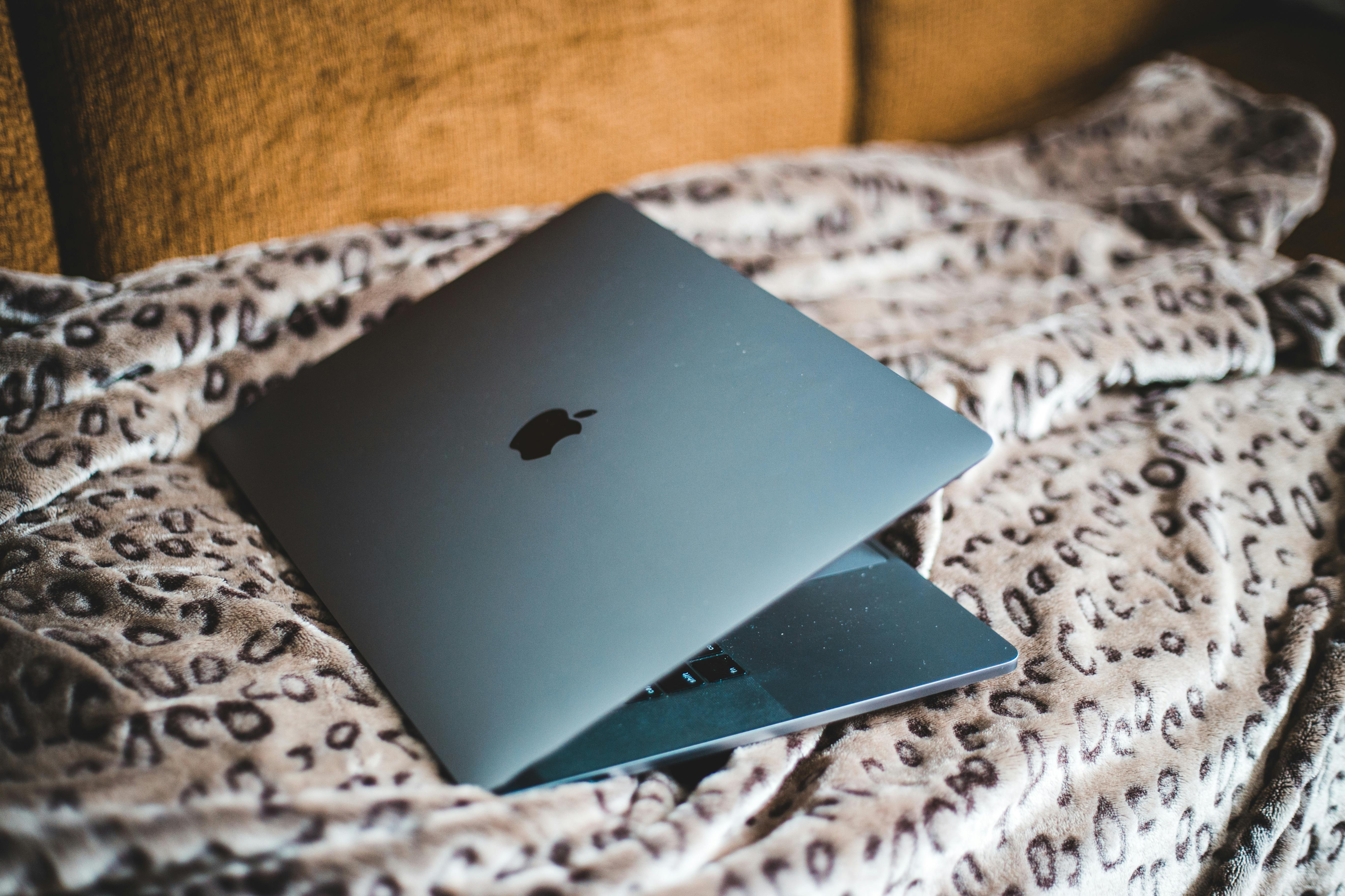 Silver Macbook on White and Brown Textile · Free Stock Photo