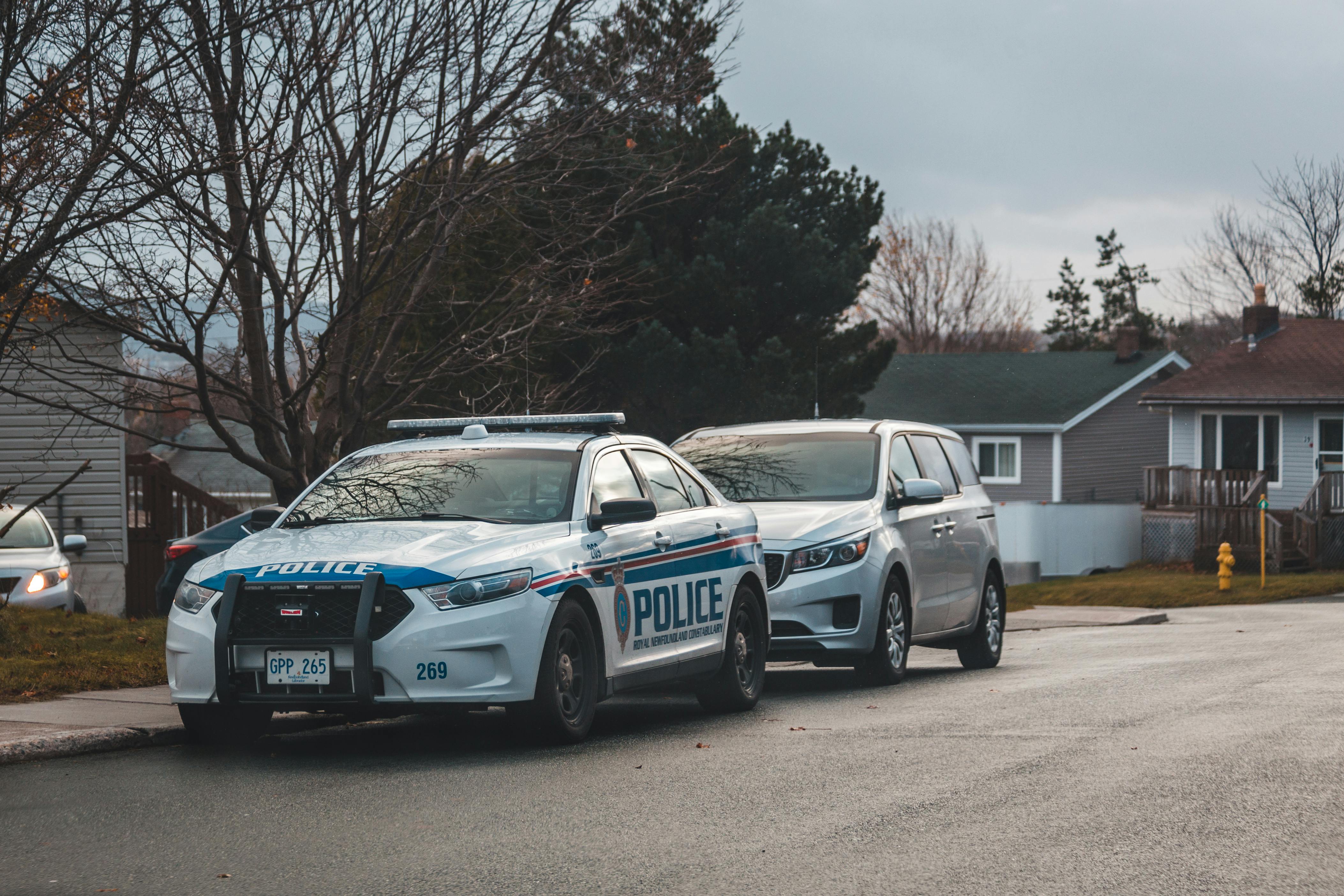 Blue and White Police Car on Road · Free Stock Photo