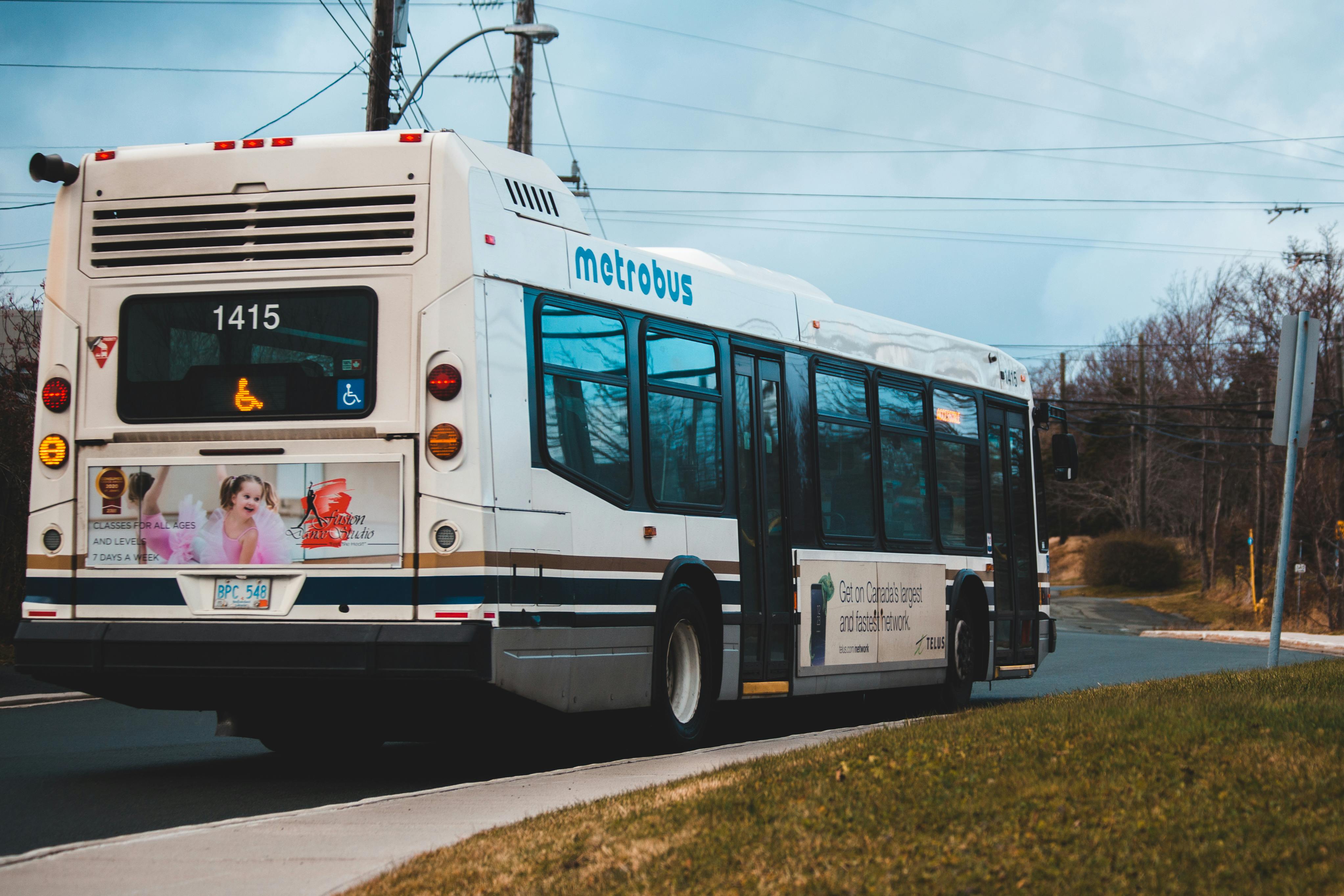 White and Black Bus on Road · Free Stock Photo