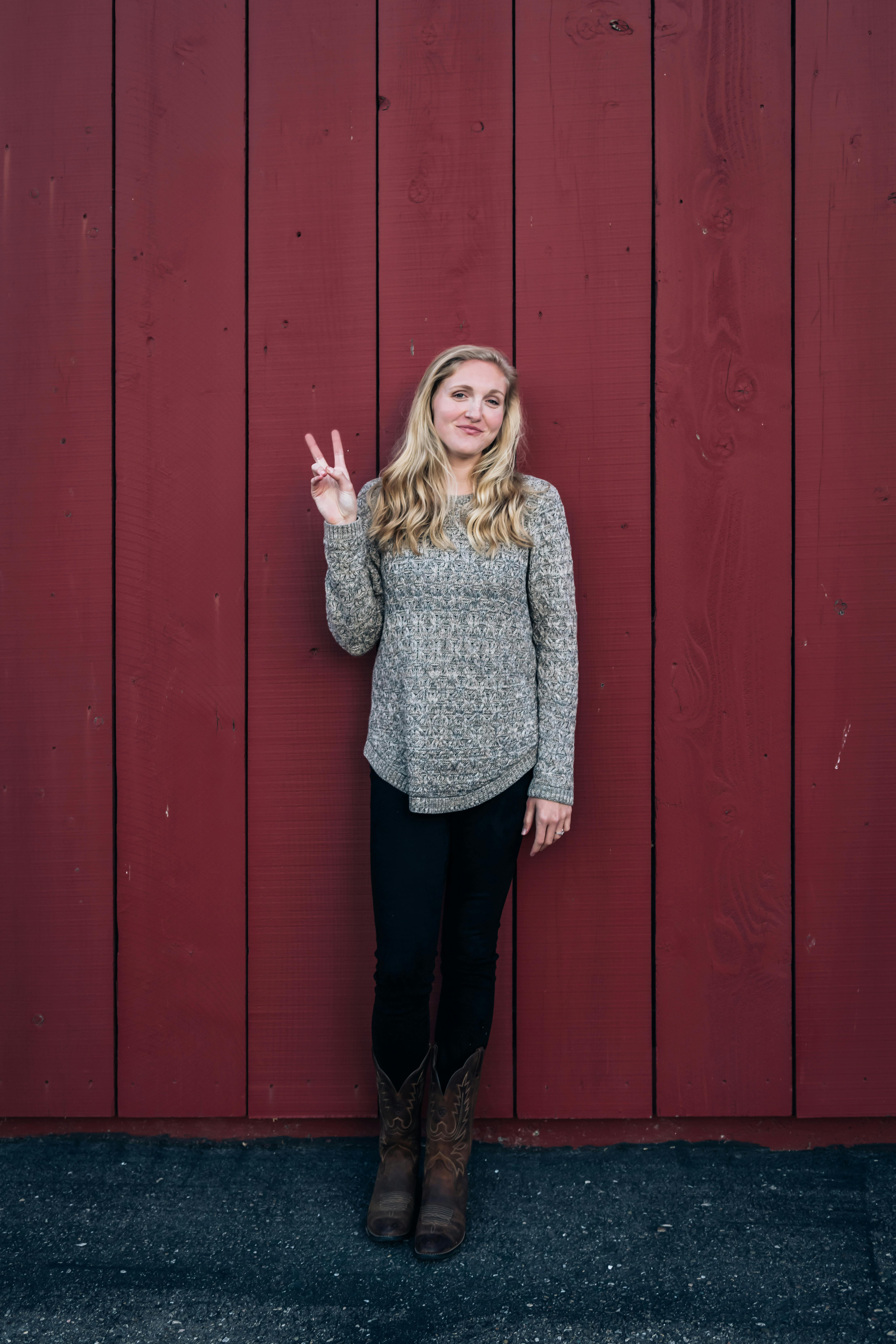 Photo Of Woman Doing Peace Sign · Free Stock Photo