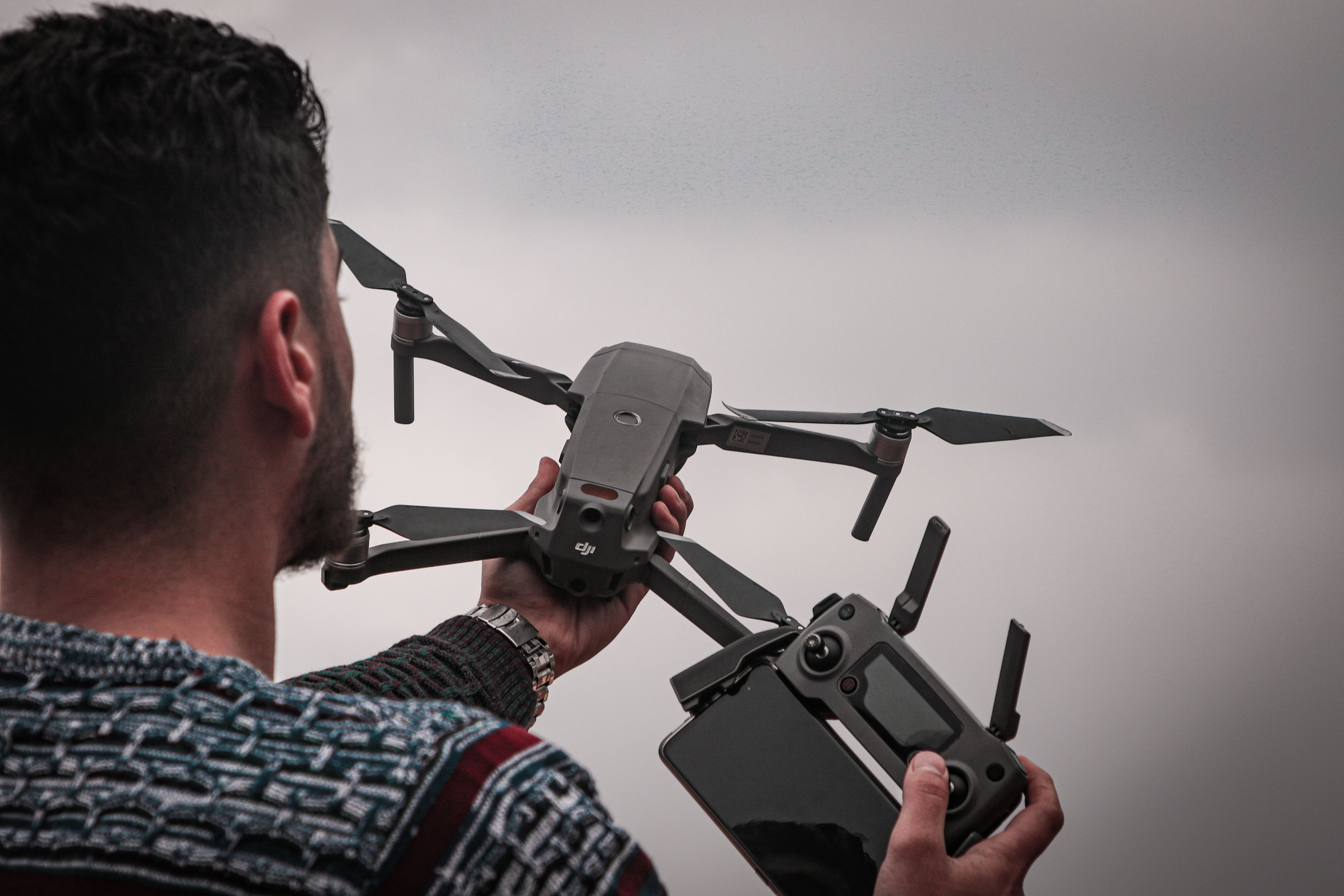 Man Holding Black Drone · Free Stock Photo