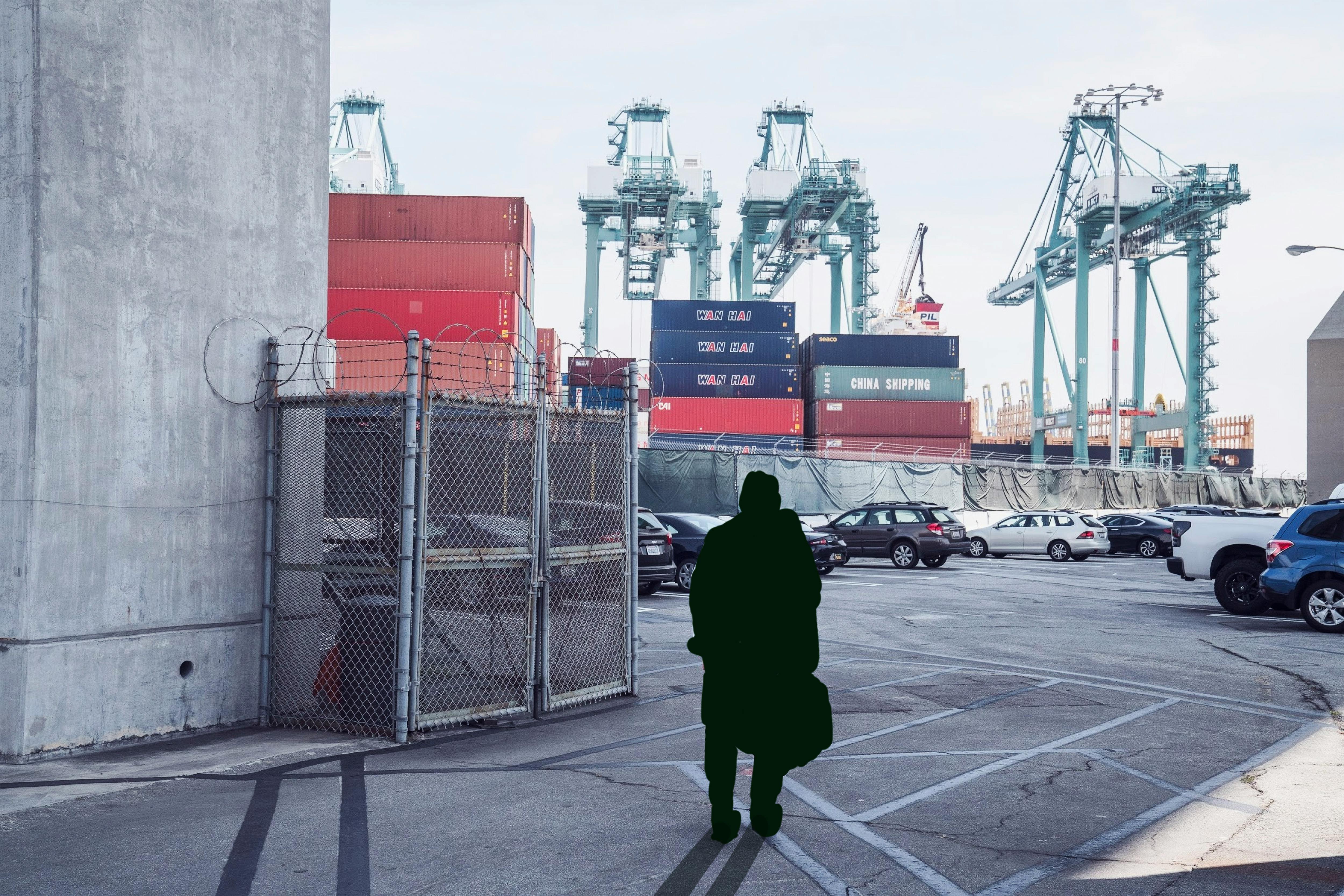 Unrecognizable man standing in cargo port · Free Stock Photo