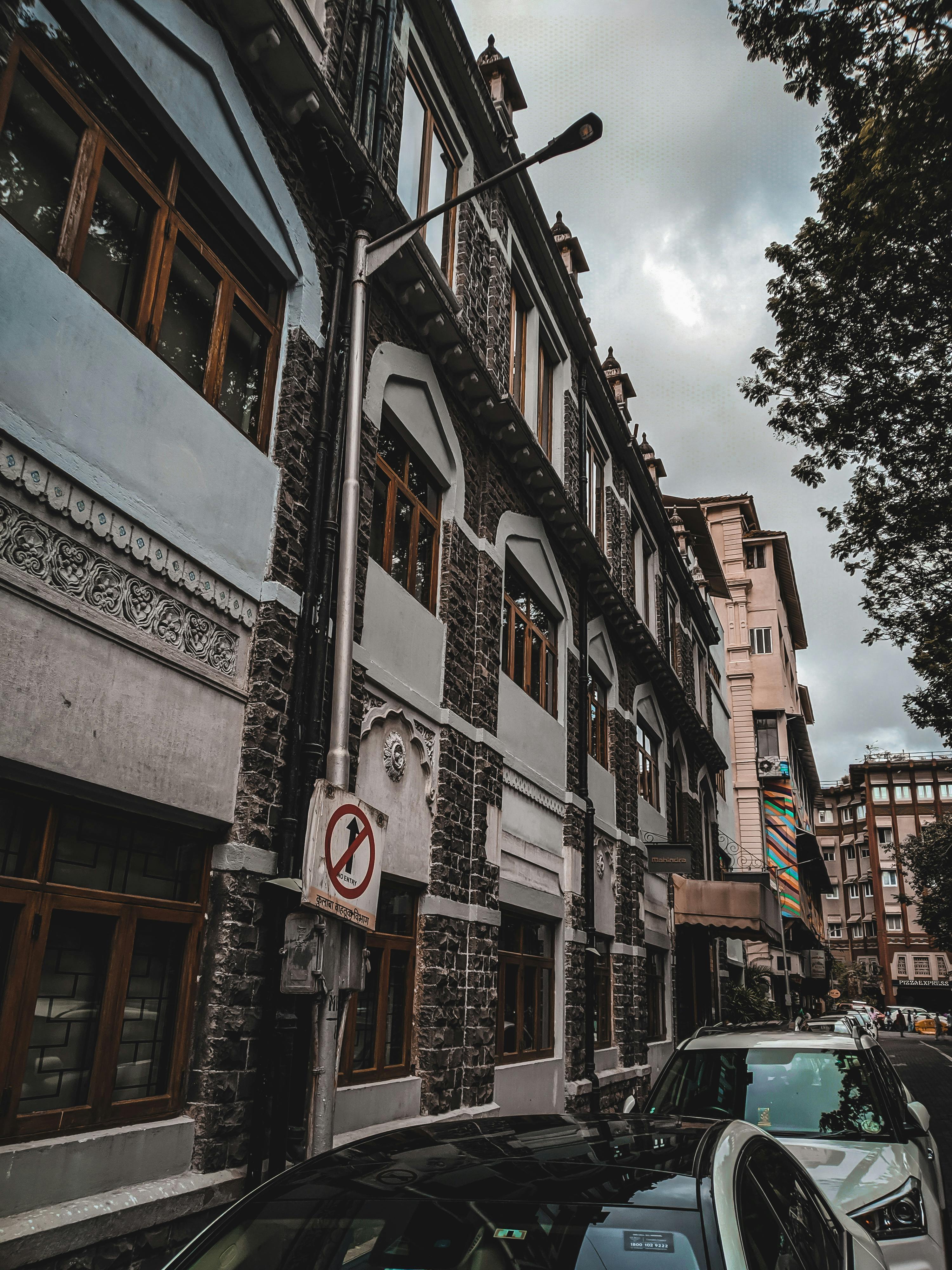Facade of old residential buildings in city street · Free Stock Photo