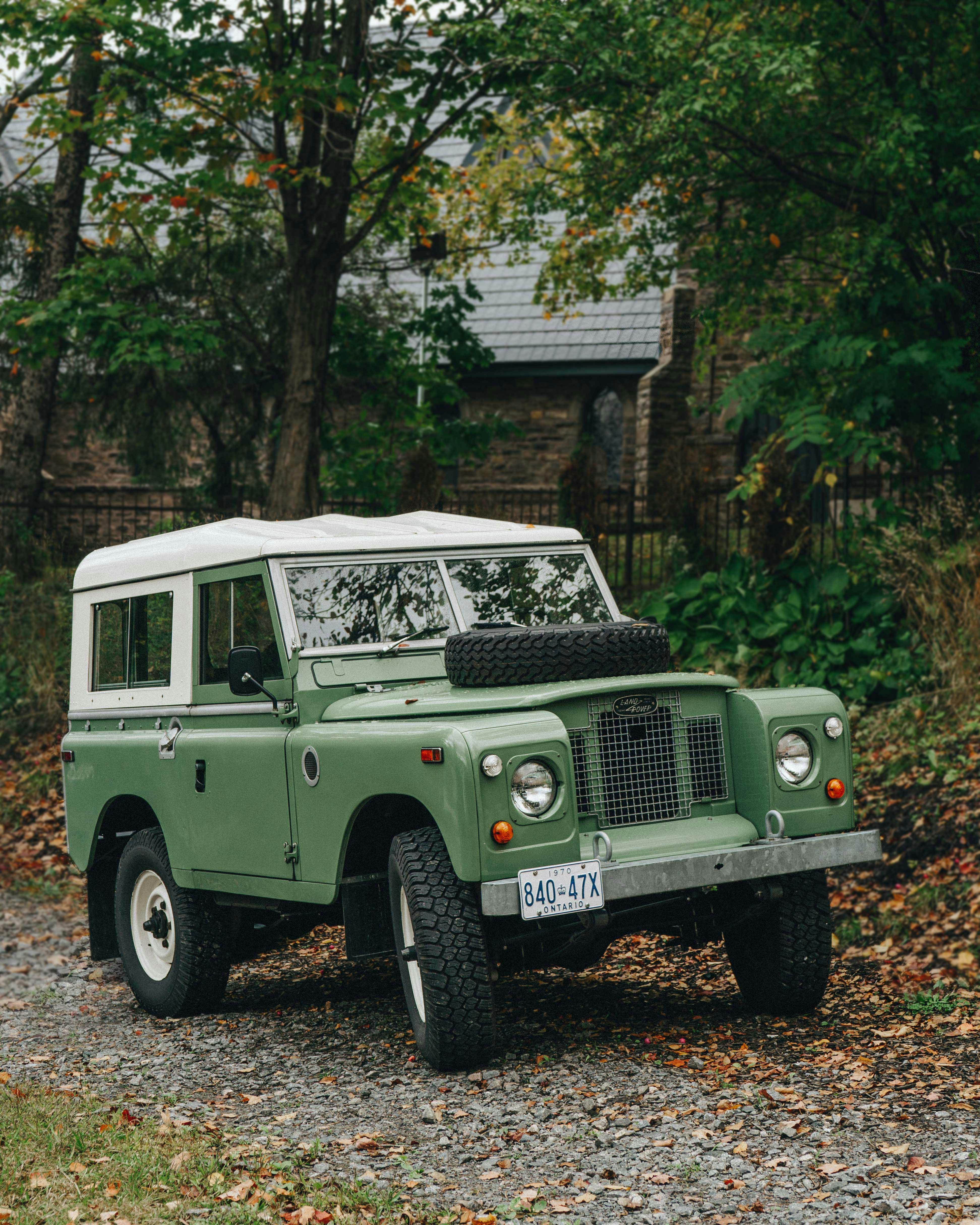 Green and White Jeep Wrangler Parked Near Green Trees · Free Stock Photo
