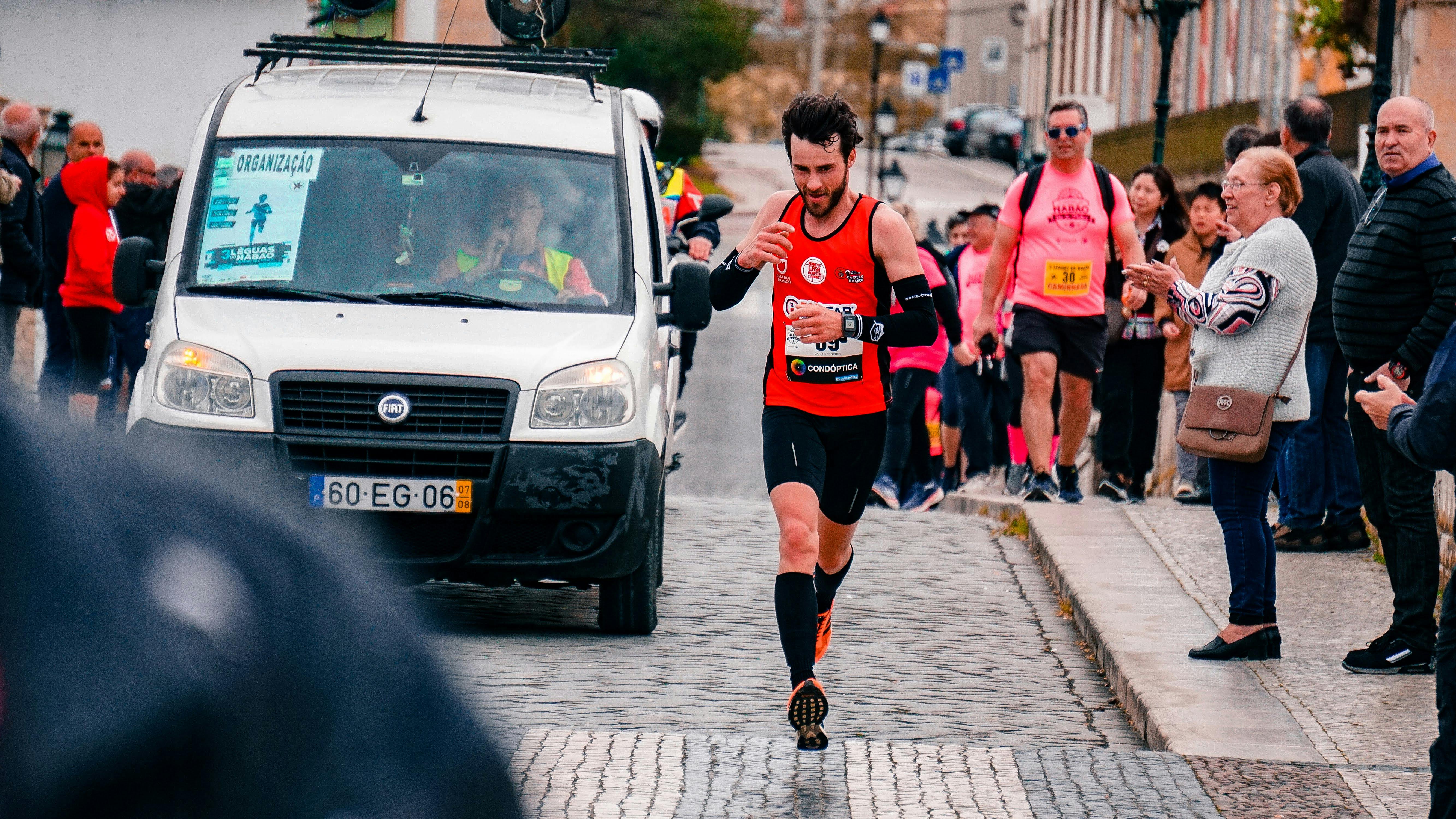 Man in Red Tank Top Running on Street · Free Stock Photo