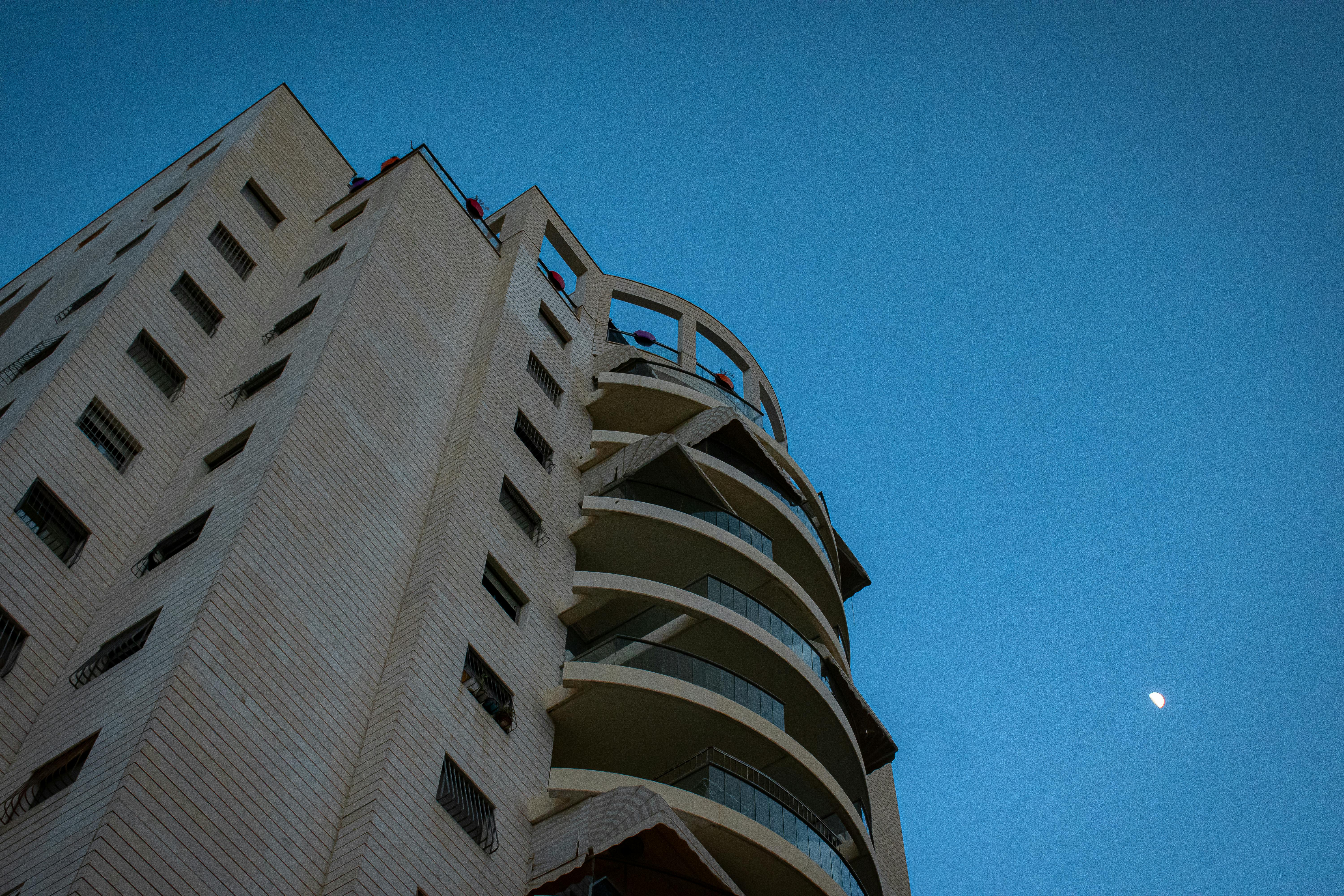Concrete Building Under Blue Sky · Free Stock Photo