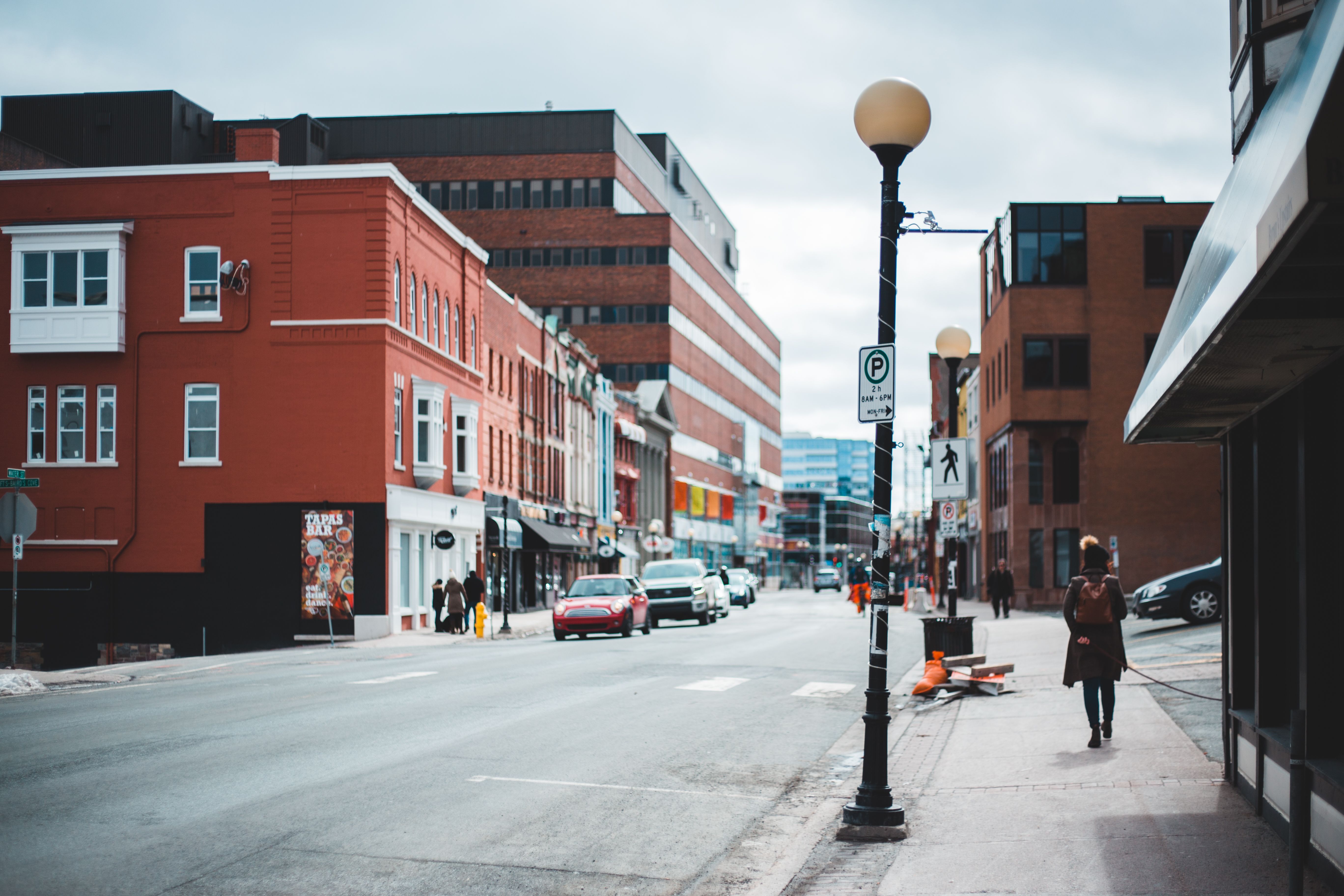 Cars on Road Near Concrete Building · Free Stock Photo