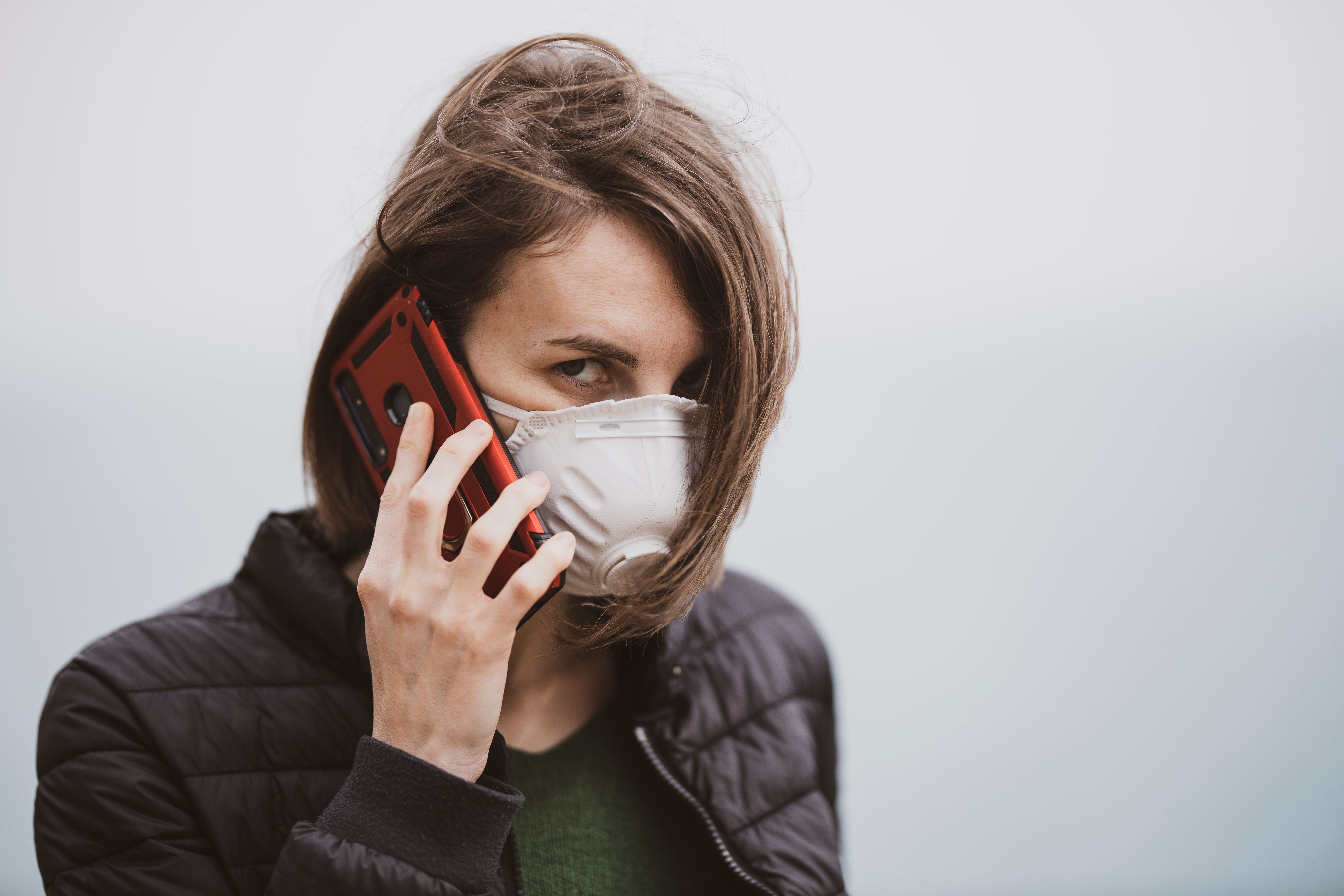 A Female Receptionist Having a Phone Call · Free Stock Photo