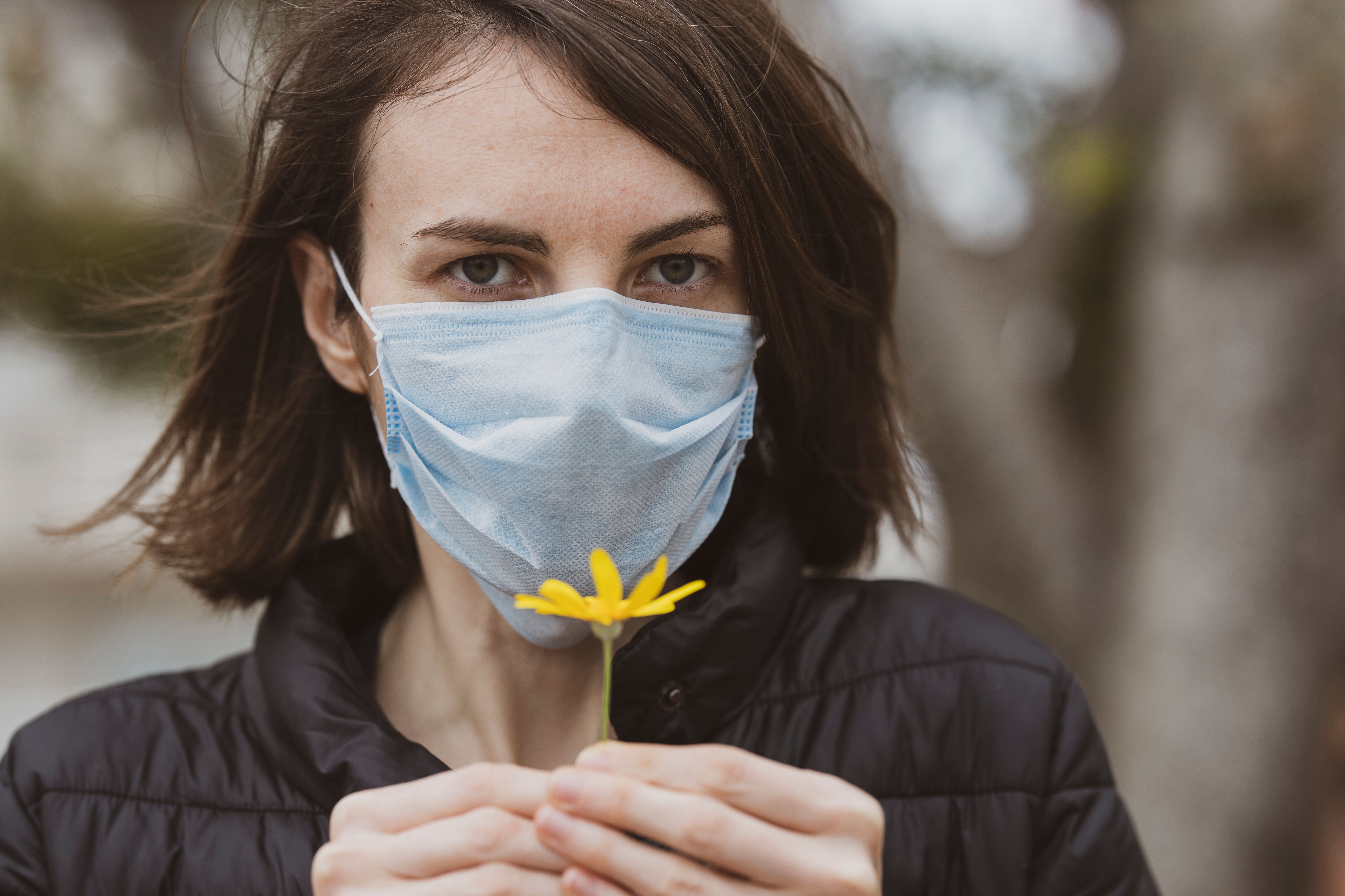 Woman in Black Jacket Covering Face With White Paper · Free Stock Photo