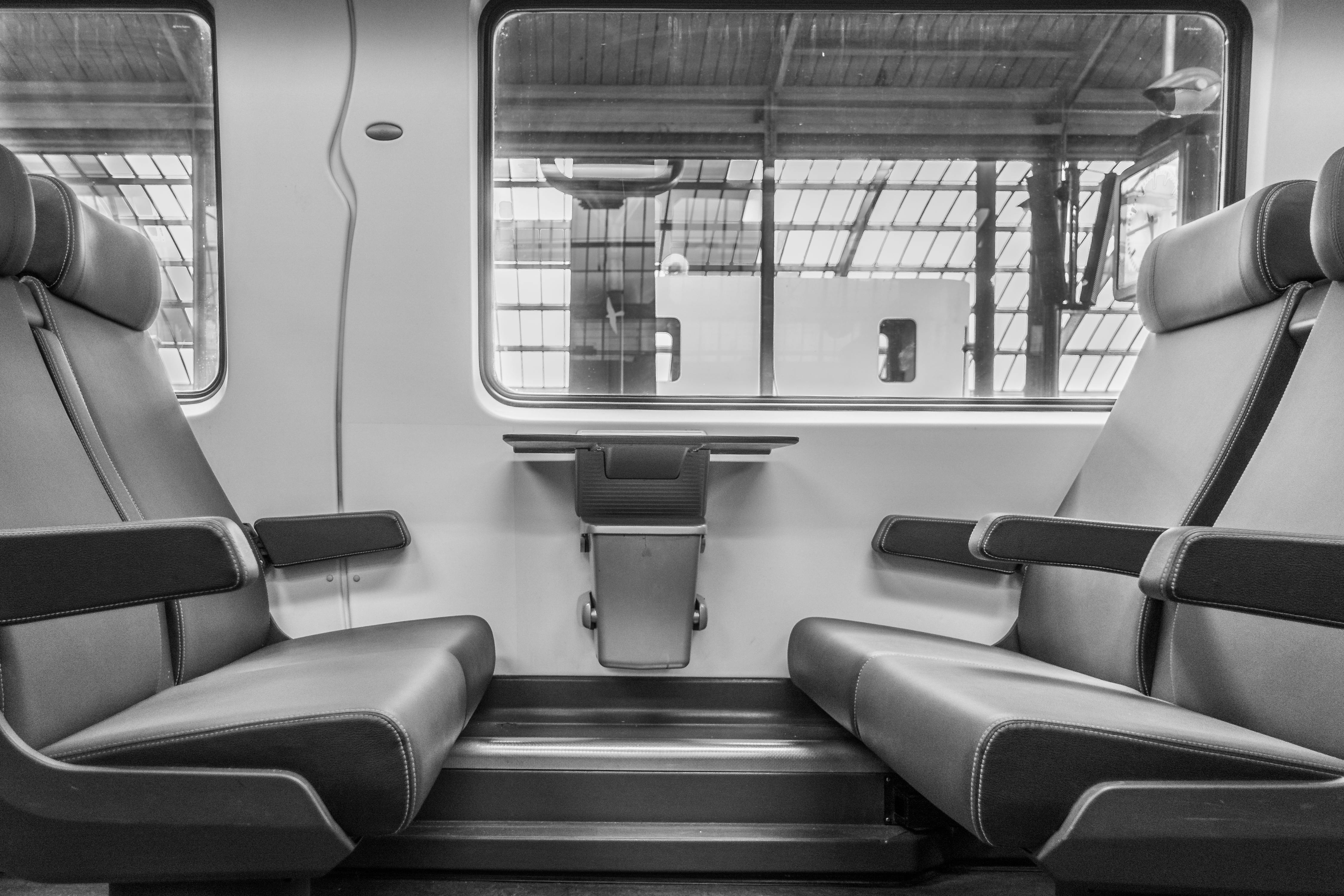 Grayscale Photograph of Vehicle Seats · Free Stock Photo