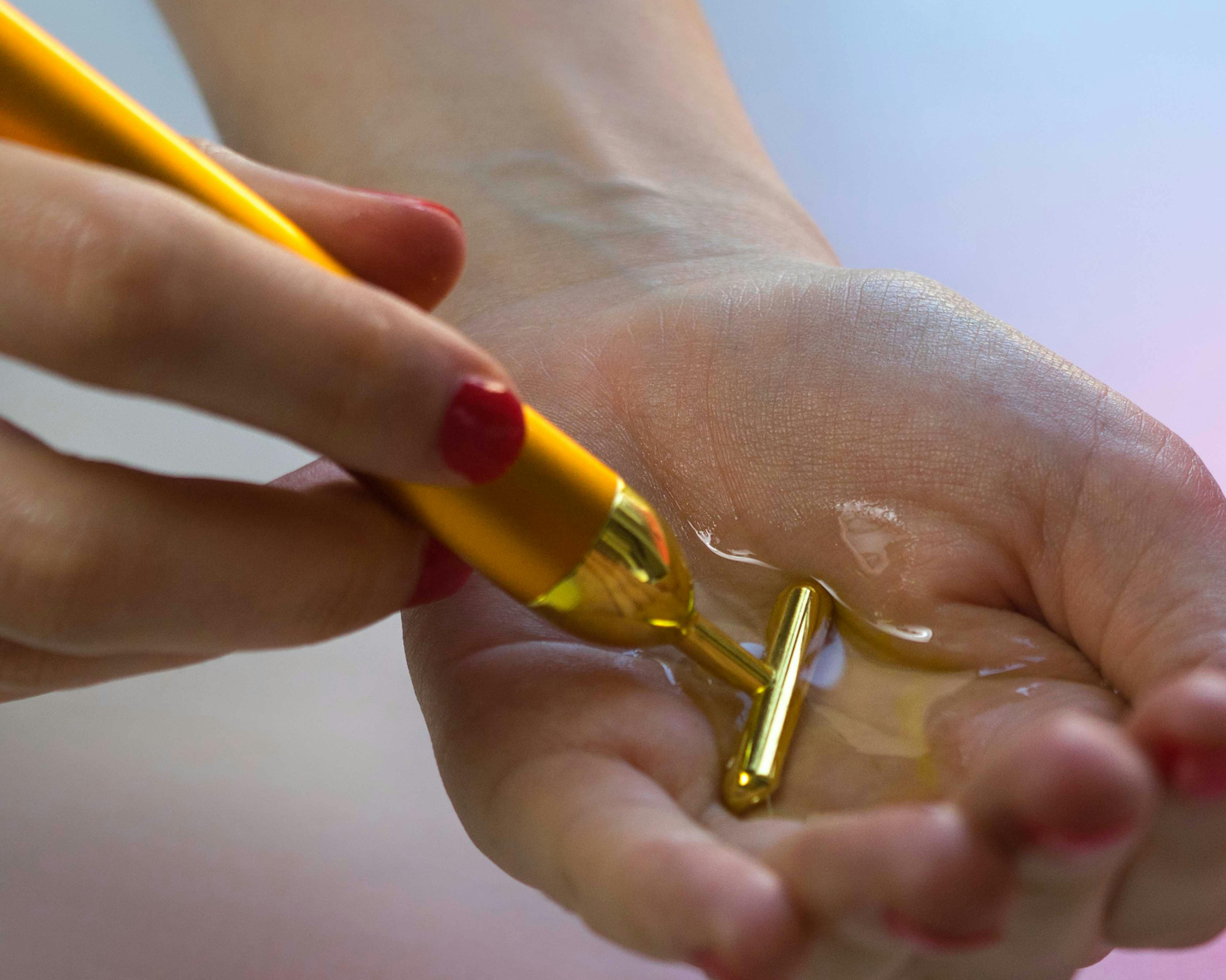 Person Holding a Dropper · Free Stock Photo