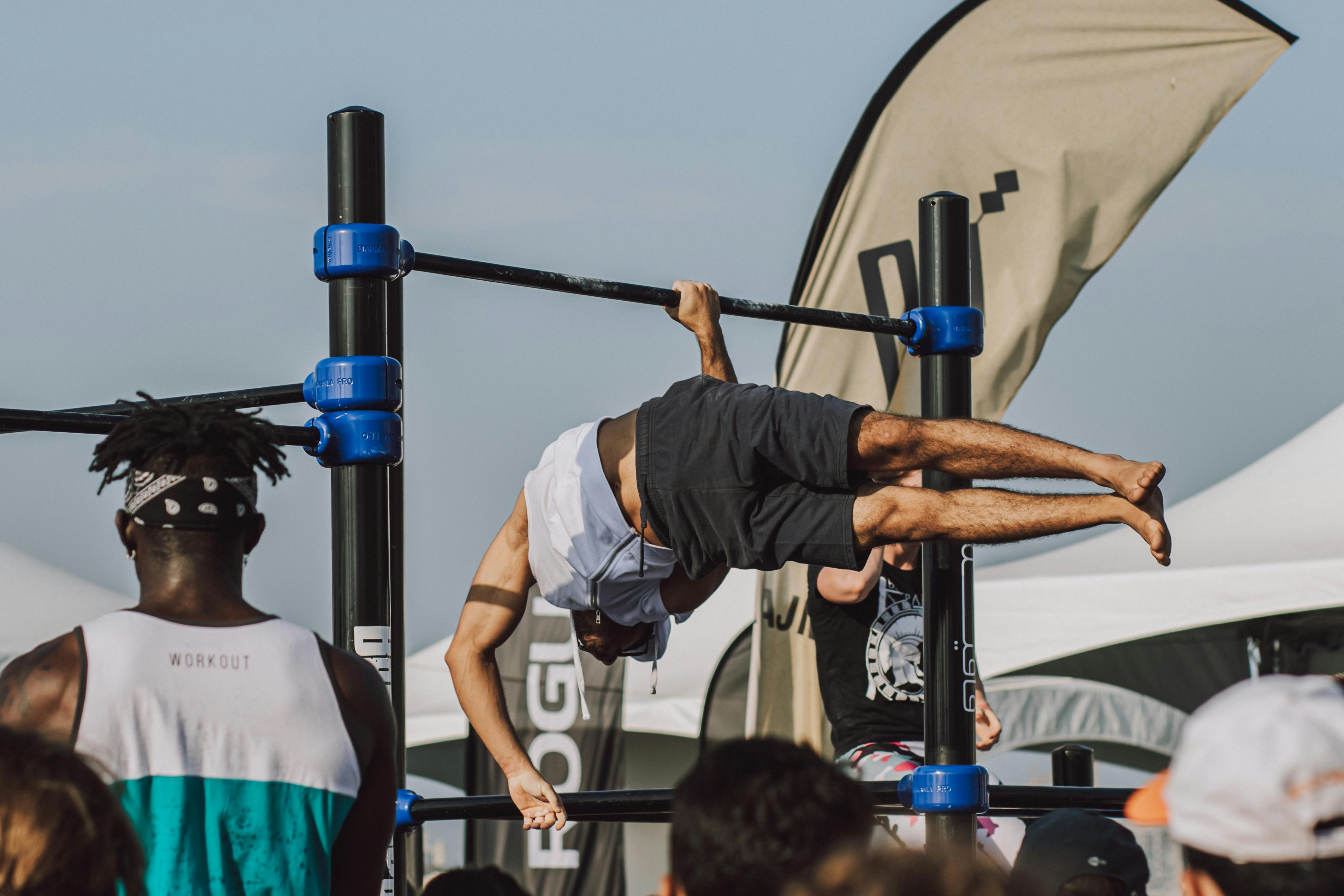 Man In Black Crew-neck Shirt Doing Pull-ups · Free Stock Photo