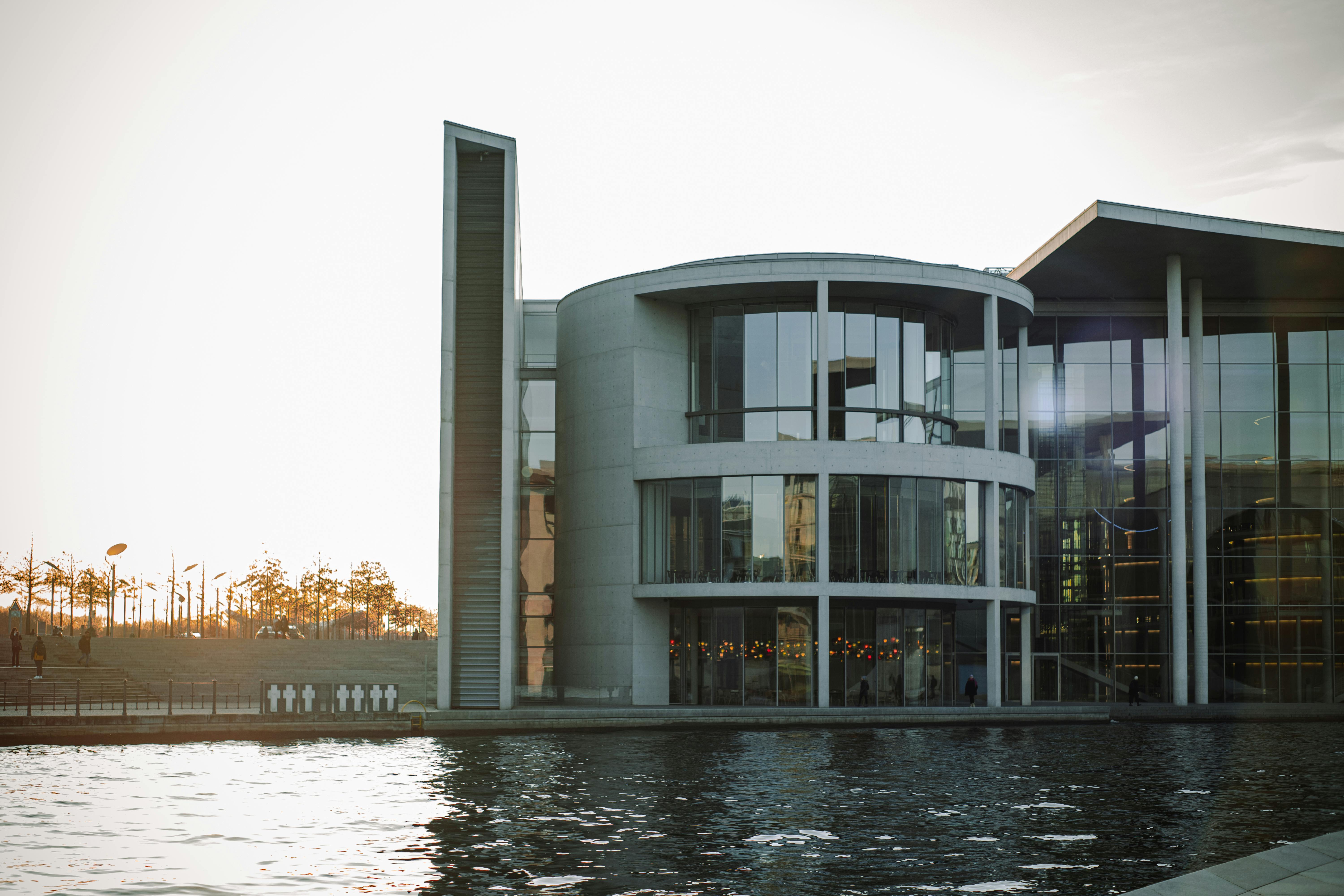 Sunlight over Building by Water · Free Stock Photo