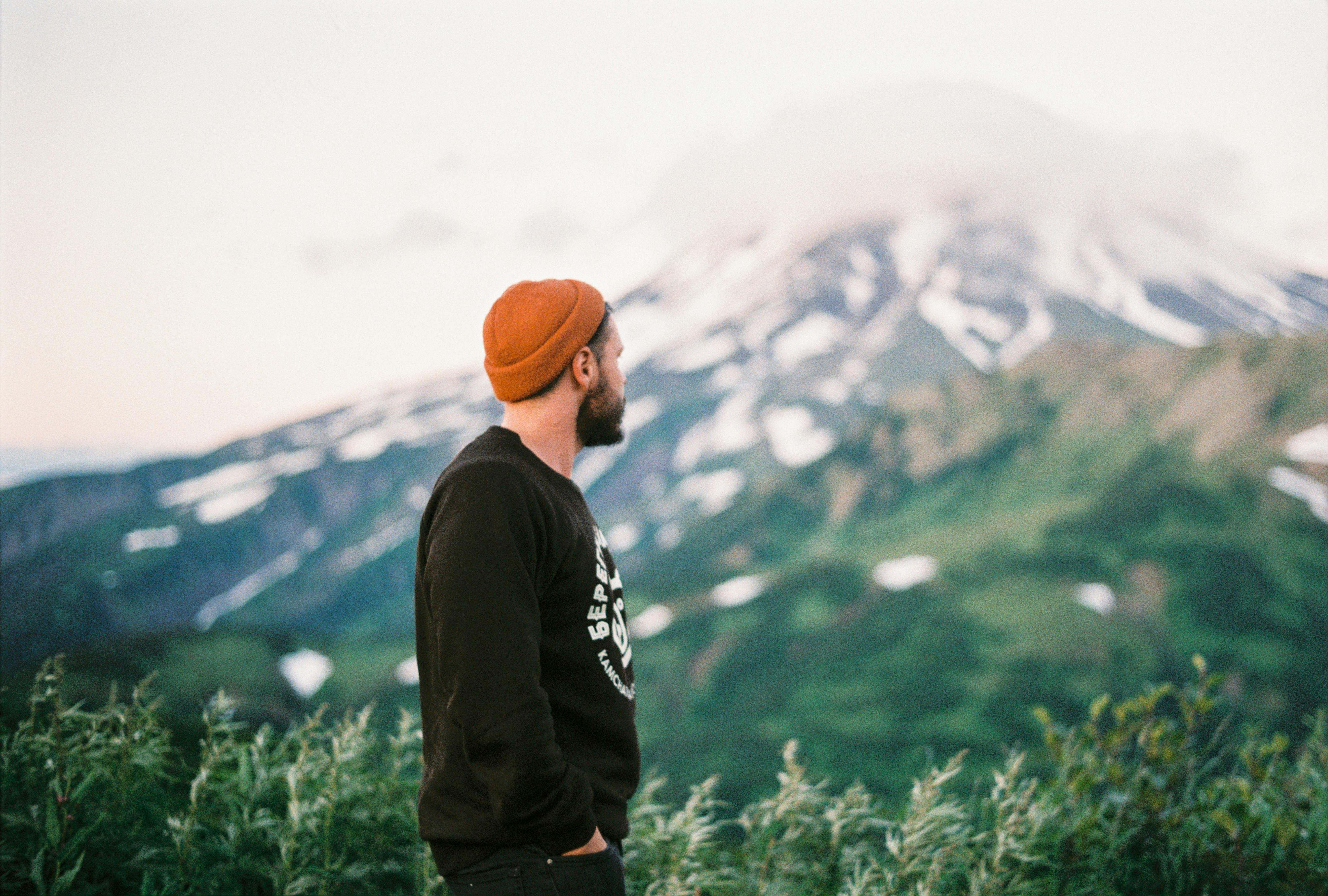 Bearded Man Lookig at a Mountain in the Distance · Free Stock Photo