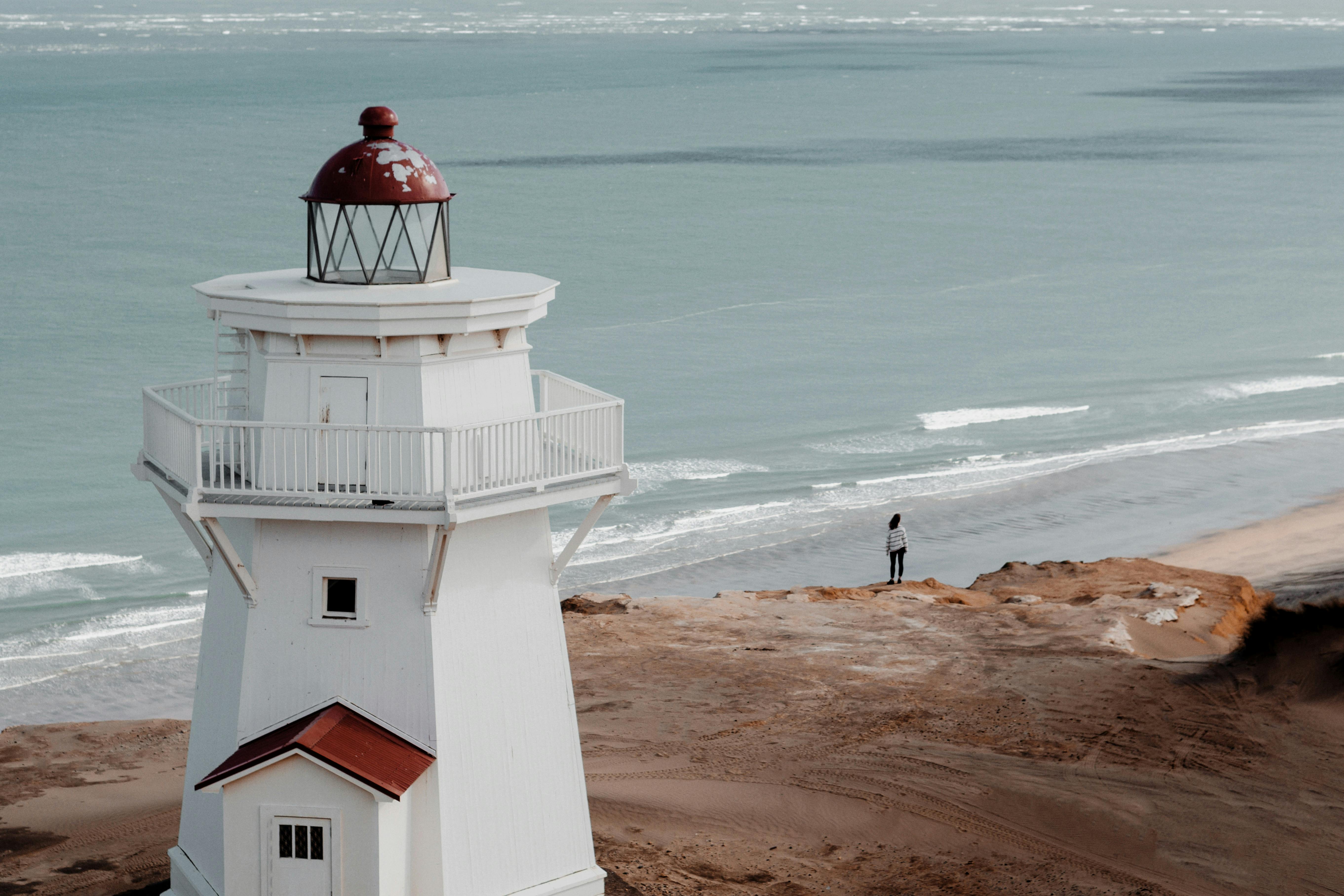 Lighthouse Near Ocean · Free Stock Photo