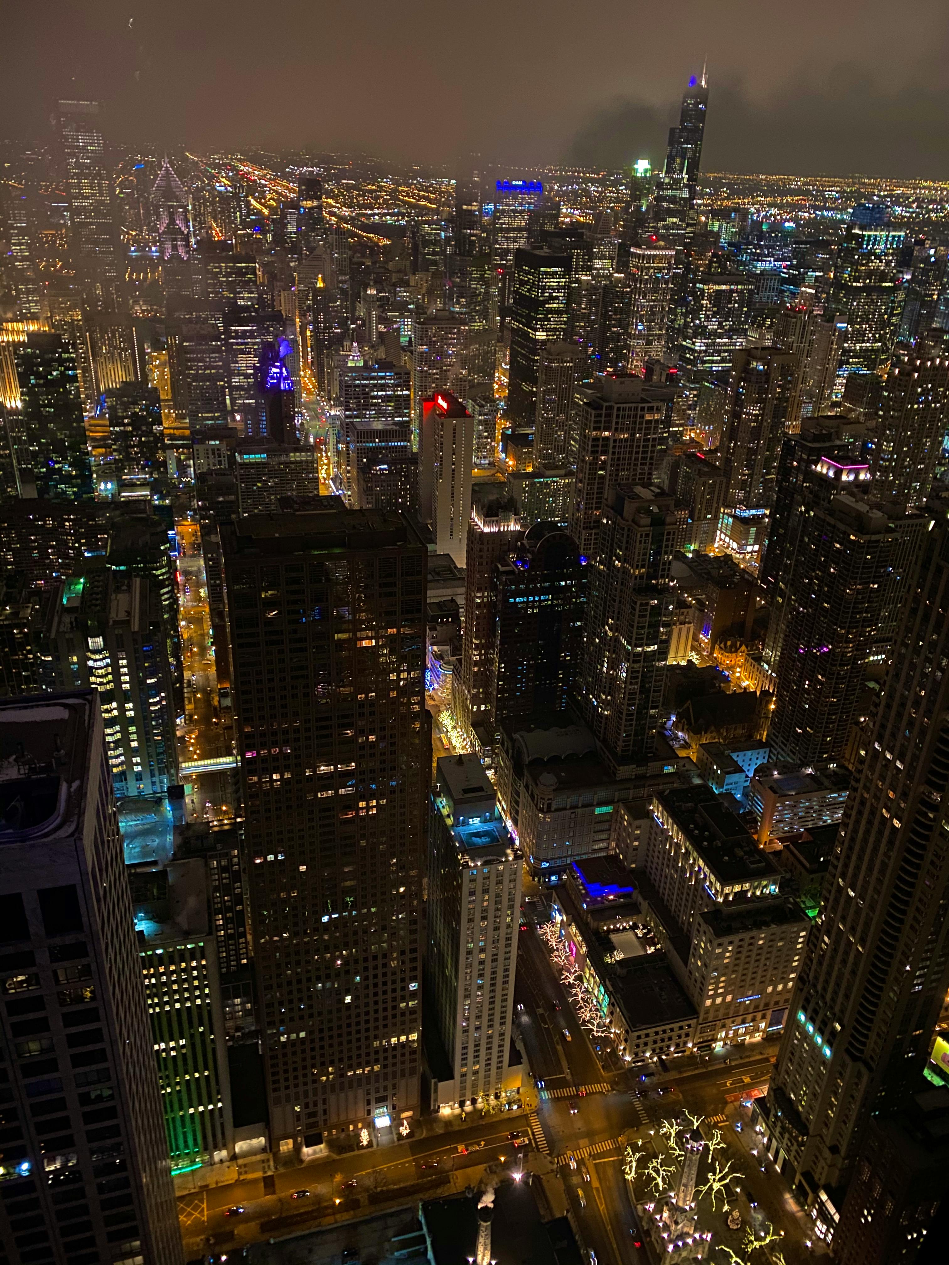 Drone view of bright cityscape at night · Free Stock Photo