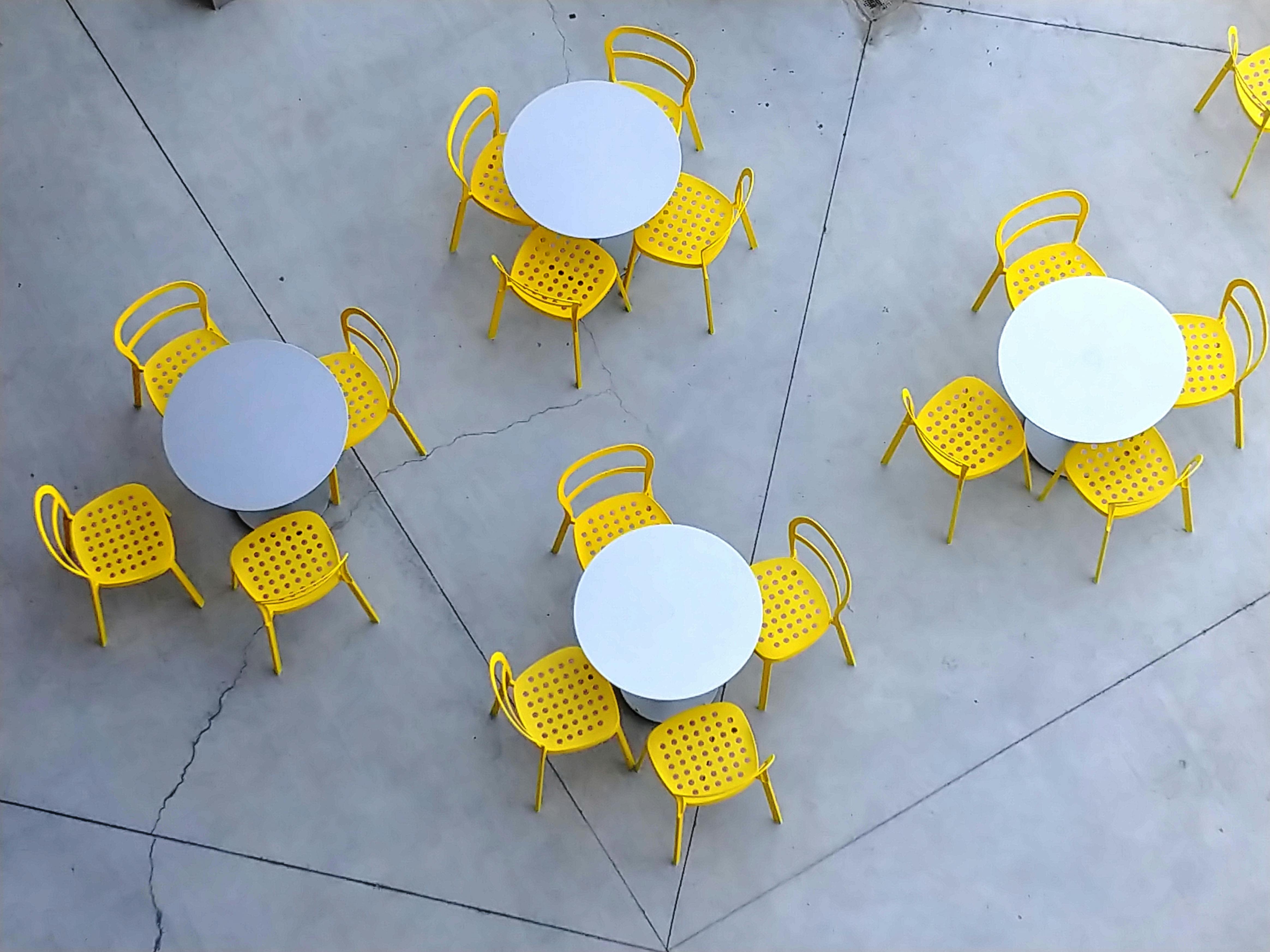 Top View of White Tables with Yellow Chairs · Free Stock Photo