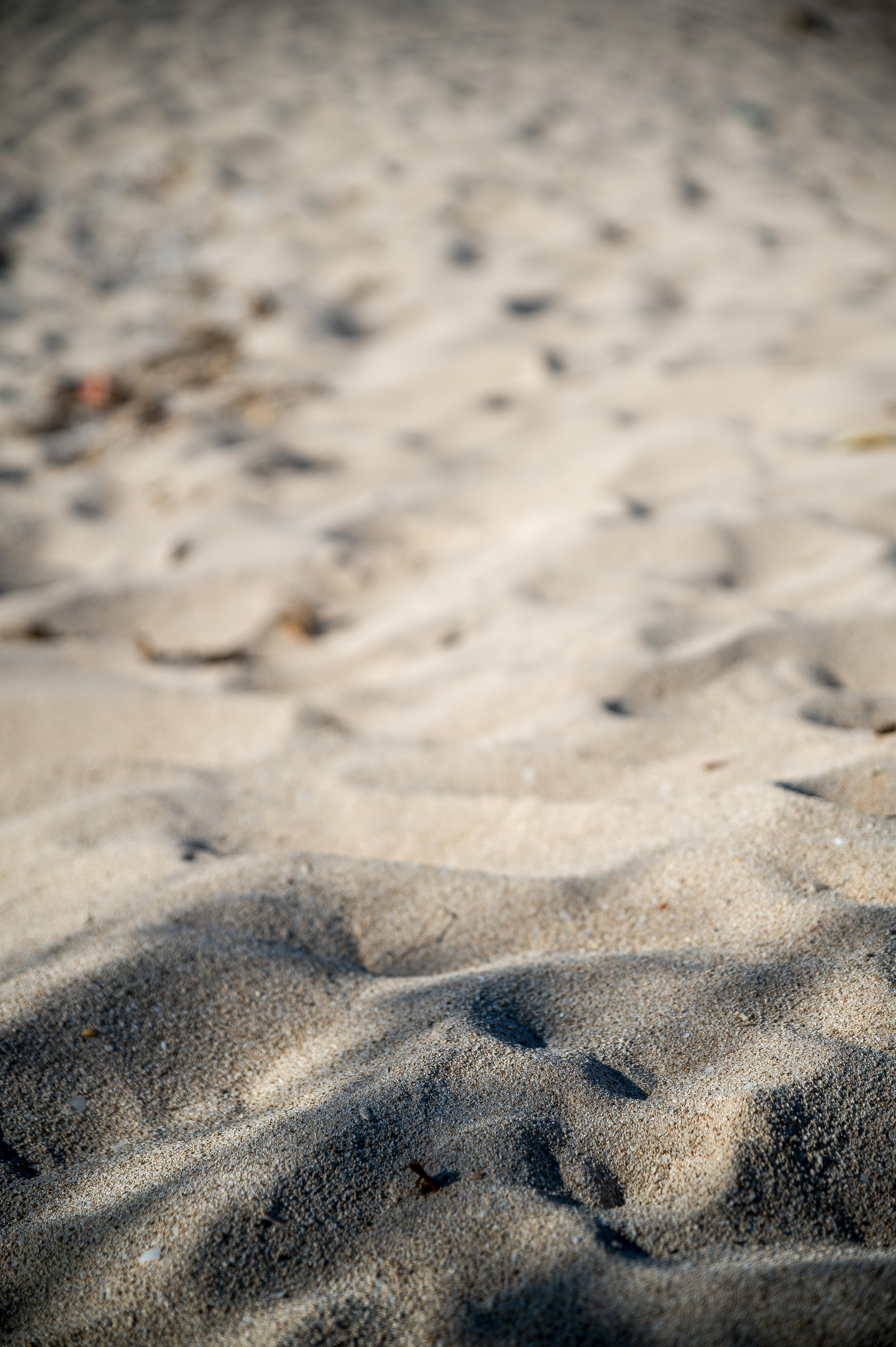 Close-Up Shot of Brown Sand · Free Stock Photo