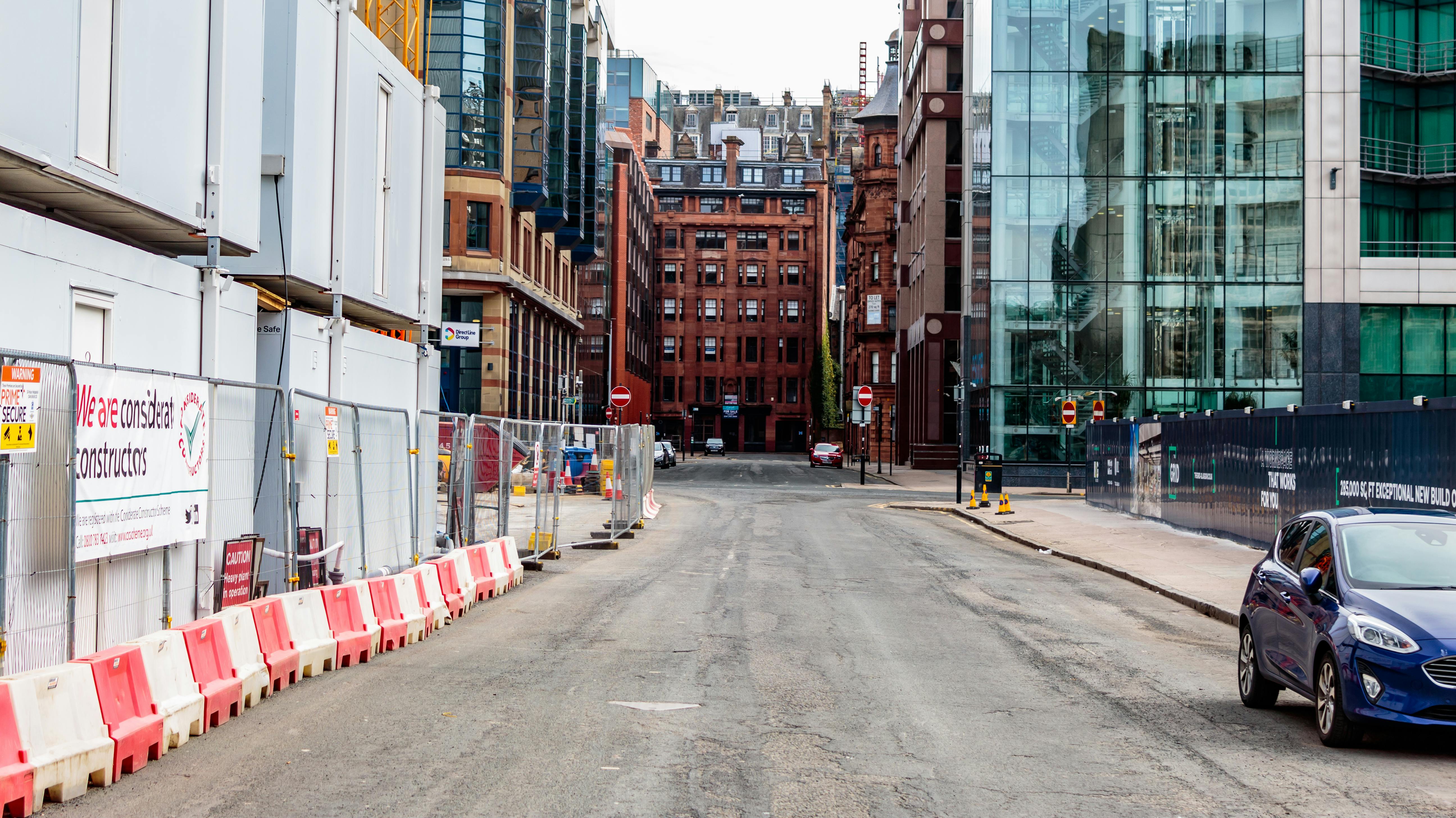 Exterior of residential buildings on street with trees and cars · Free ...