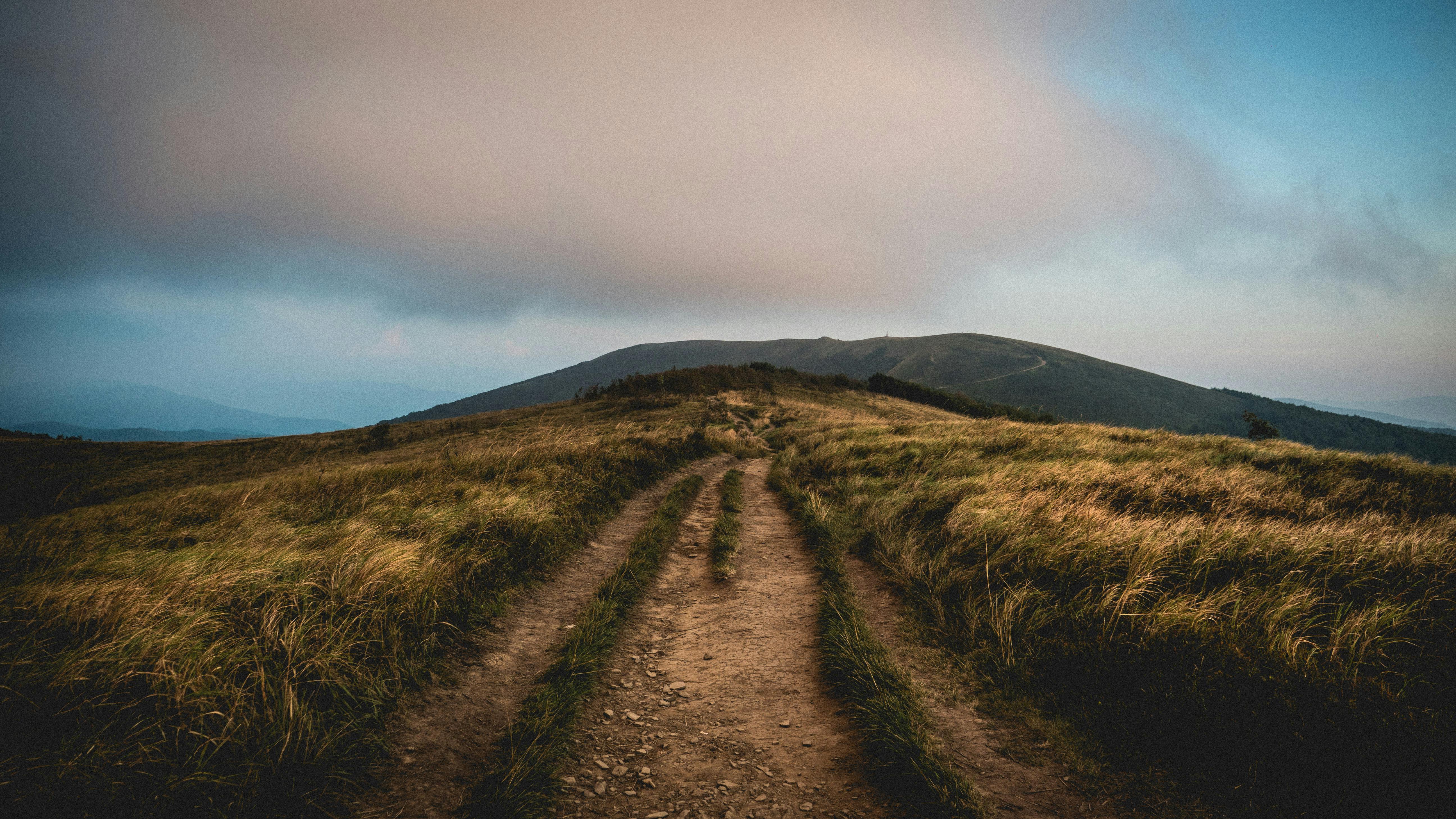 Unpaved Pathway Between Grass Field · Free Stock Photo