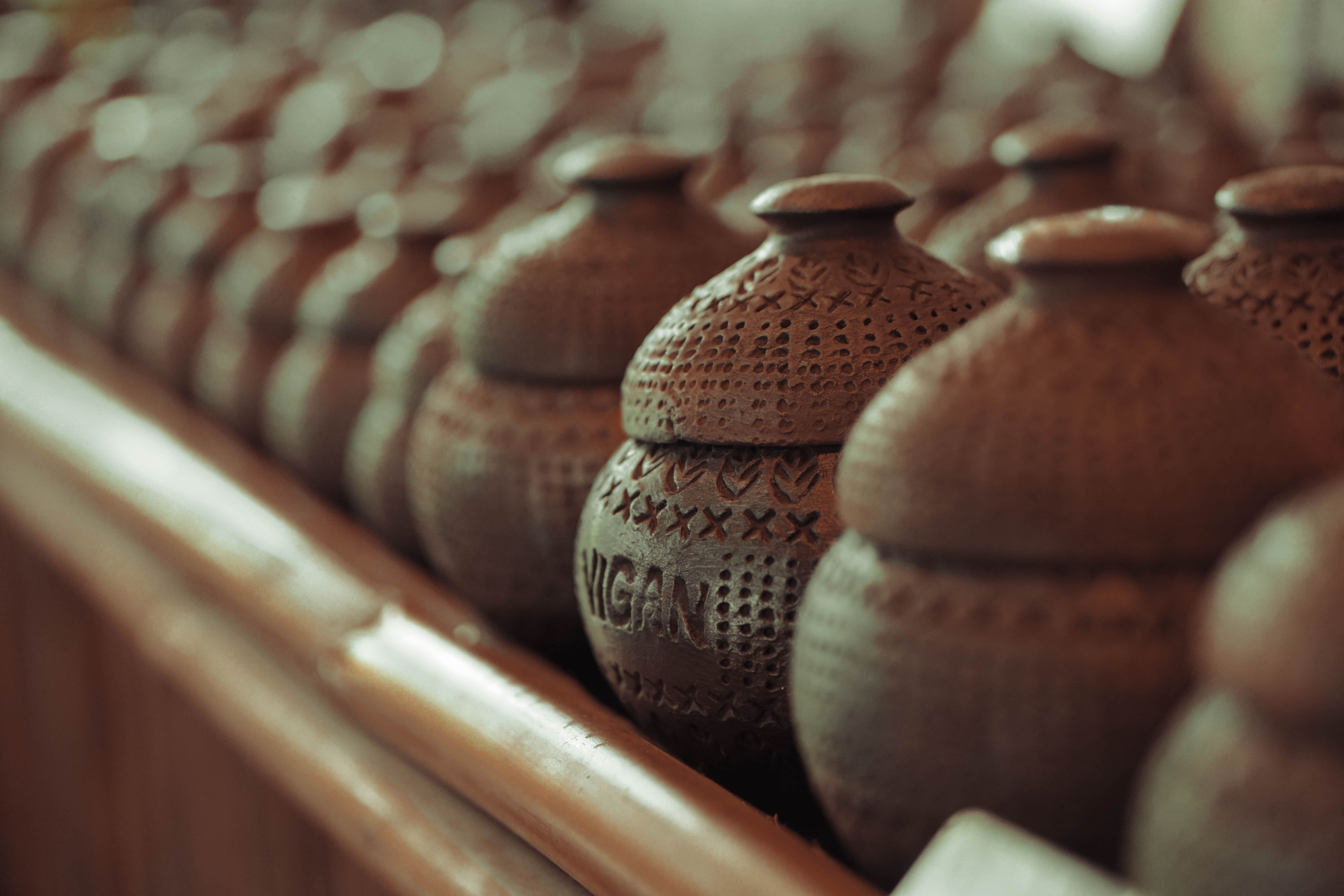 Brown Clay Pots With Cover On Display · Free Stock Photo
