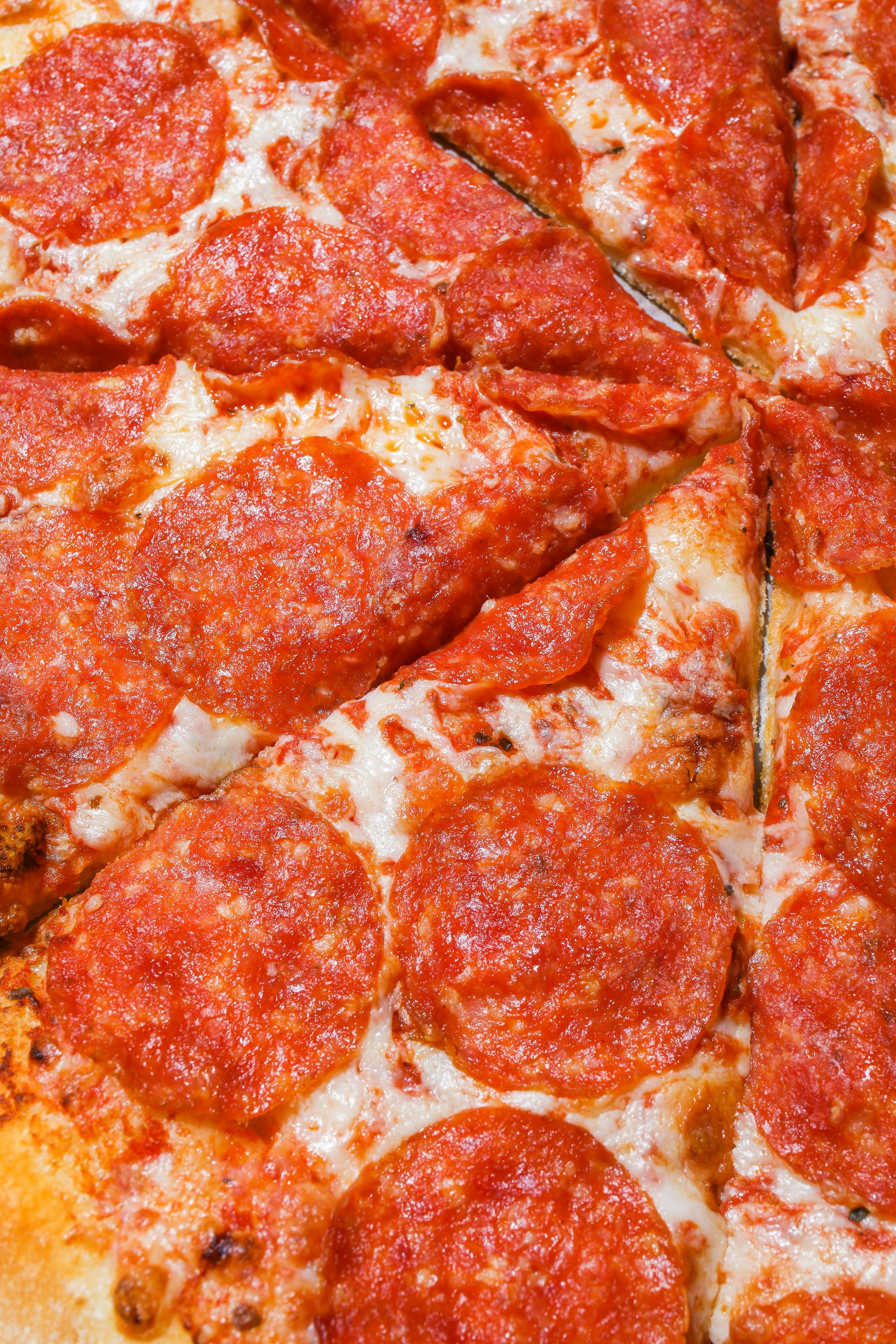 Sliced Pepperoni Pizza In Close-up View · Free Stock Photo