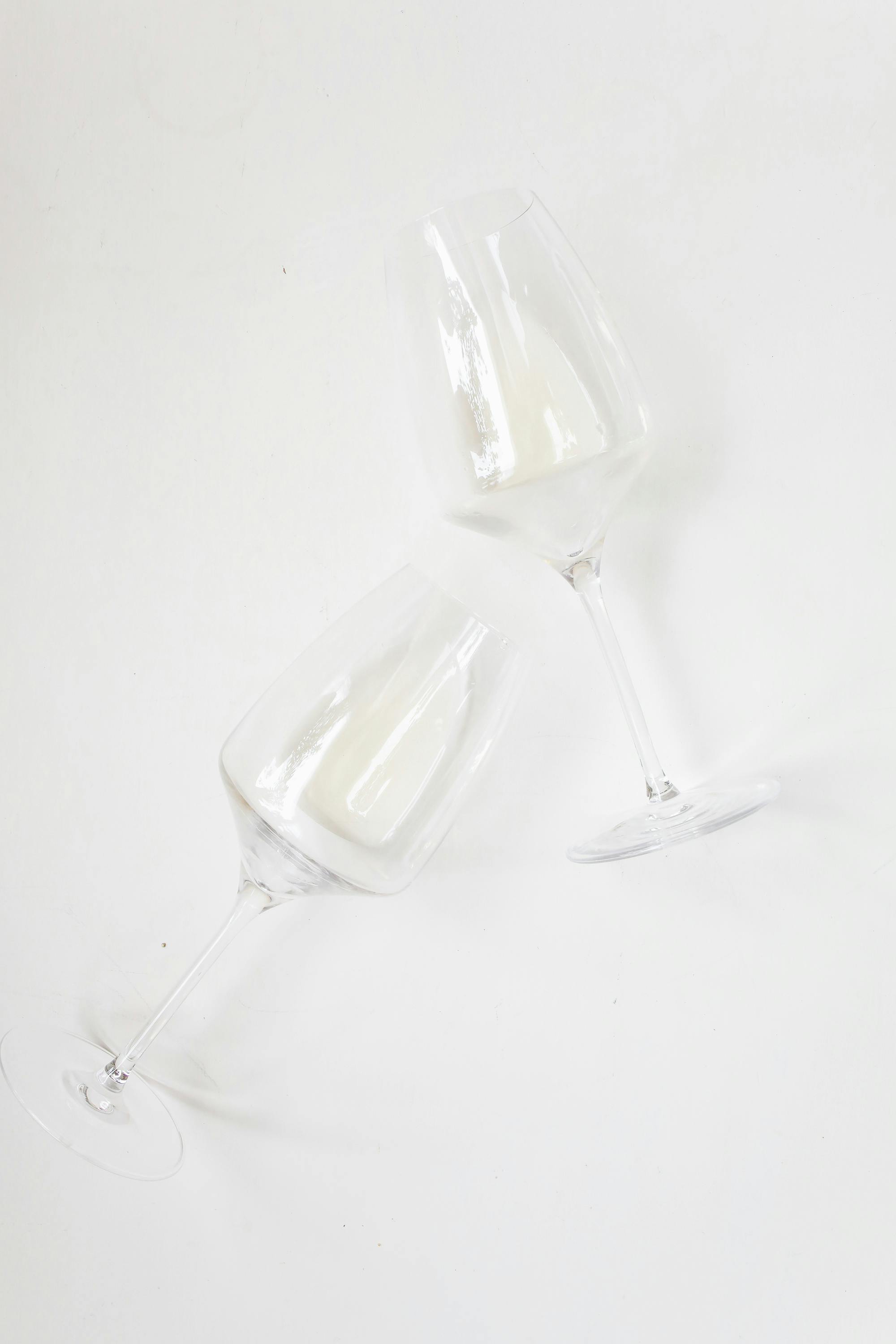 Clear Wine Glasses On White Background · Free Stock Photo