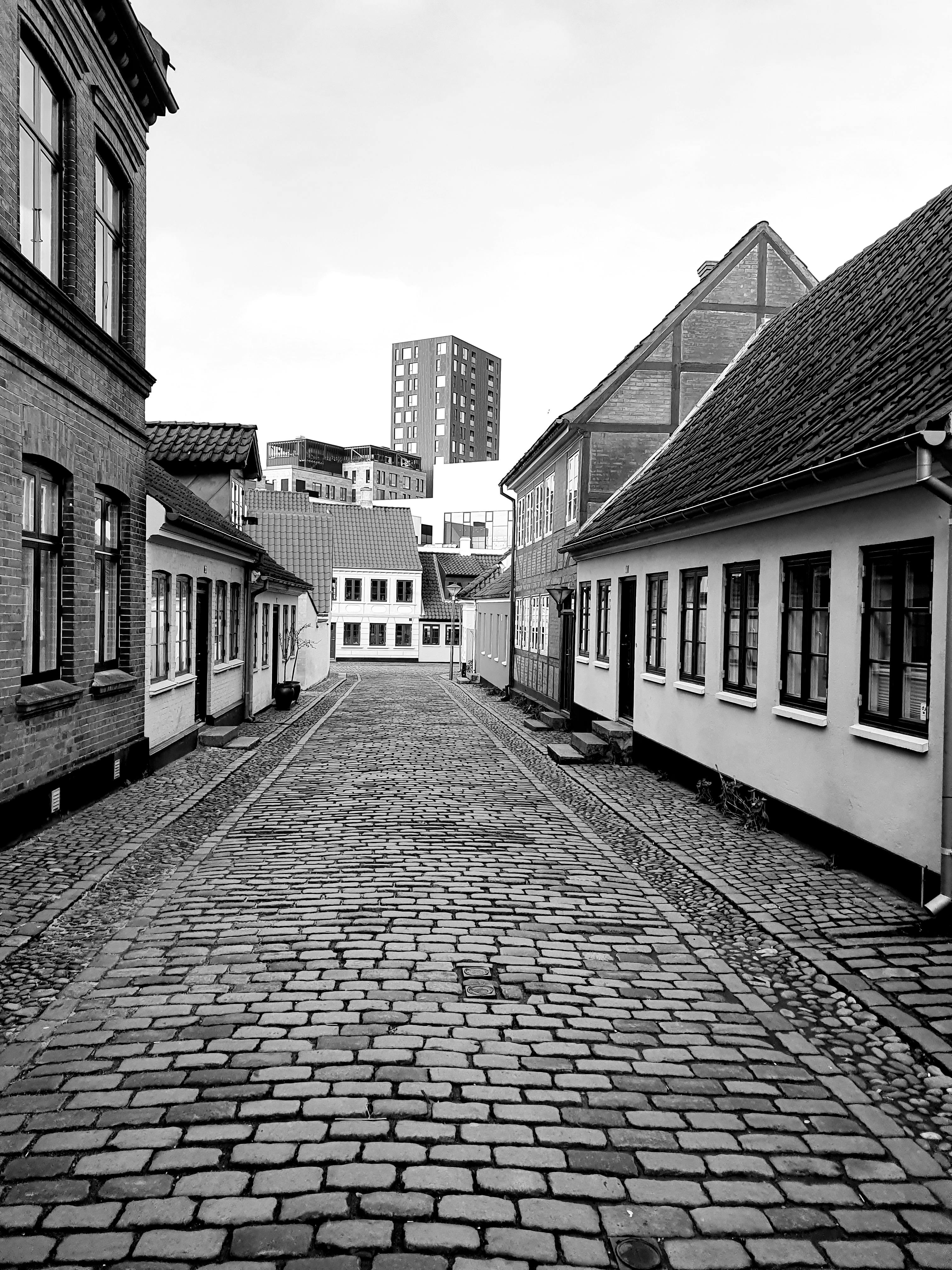 Alley Between Concrete Buildings · Free Stock Photo