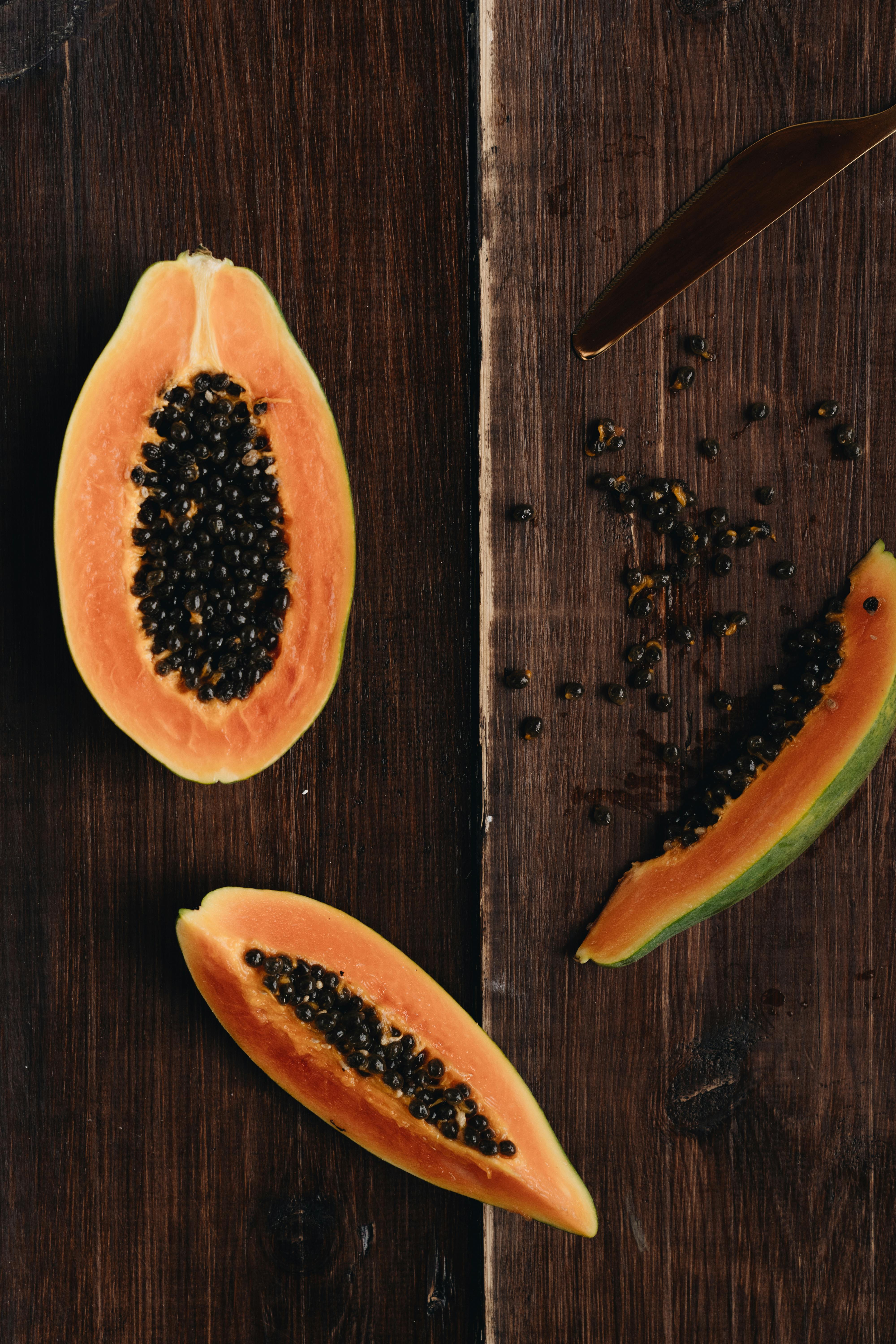 Photo Of Papaya On Top Of Wooden Surface · Free Stock Photo