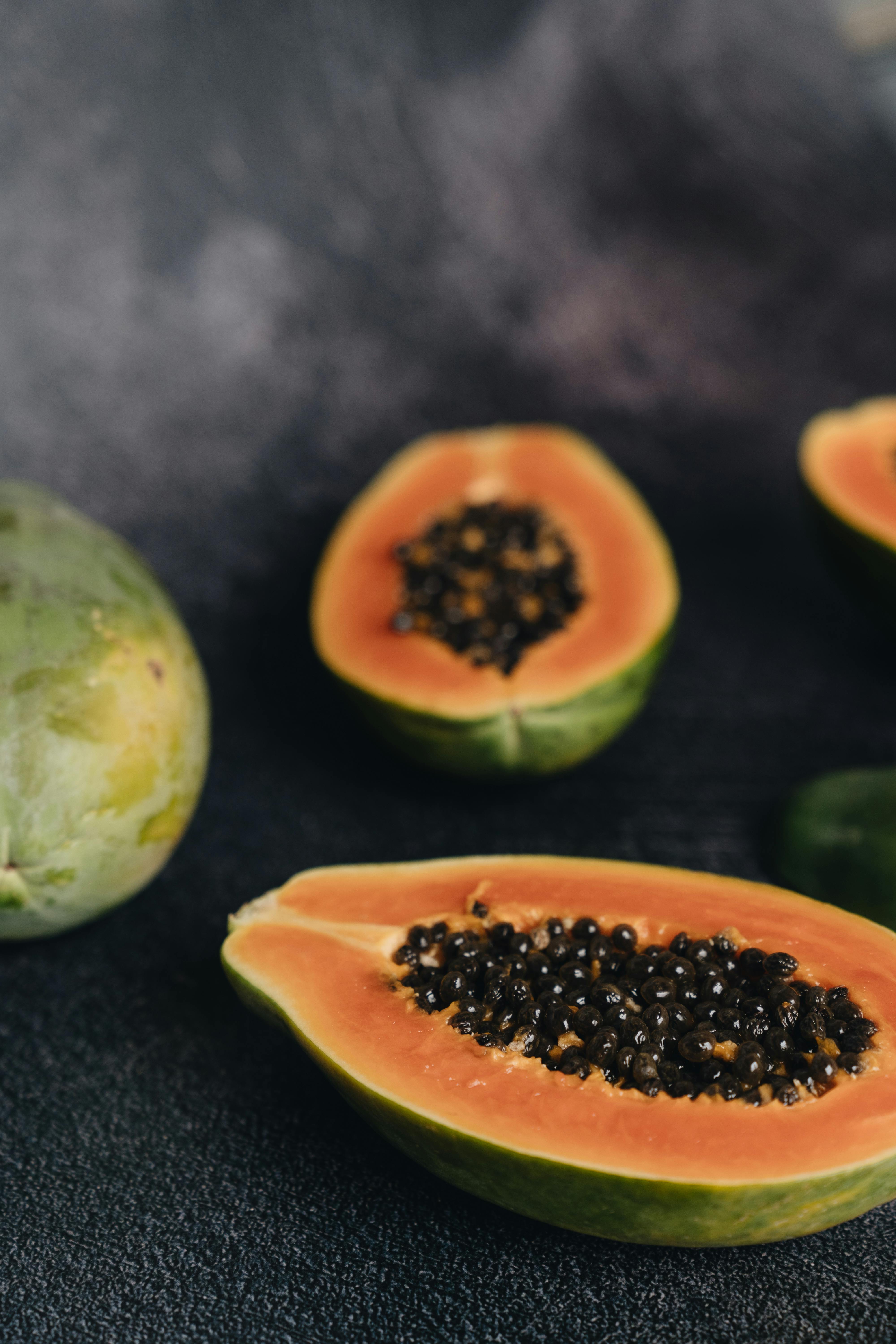 Close-Up Photo Of Sliced Papaya With Berries On Top · Free Stock Photo