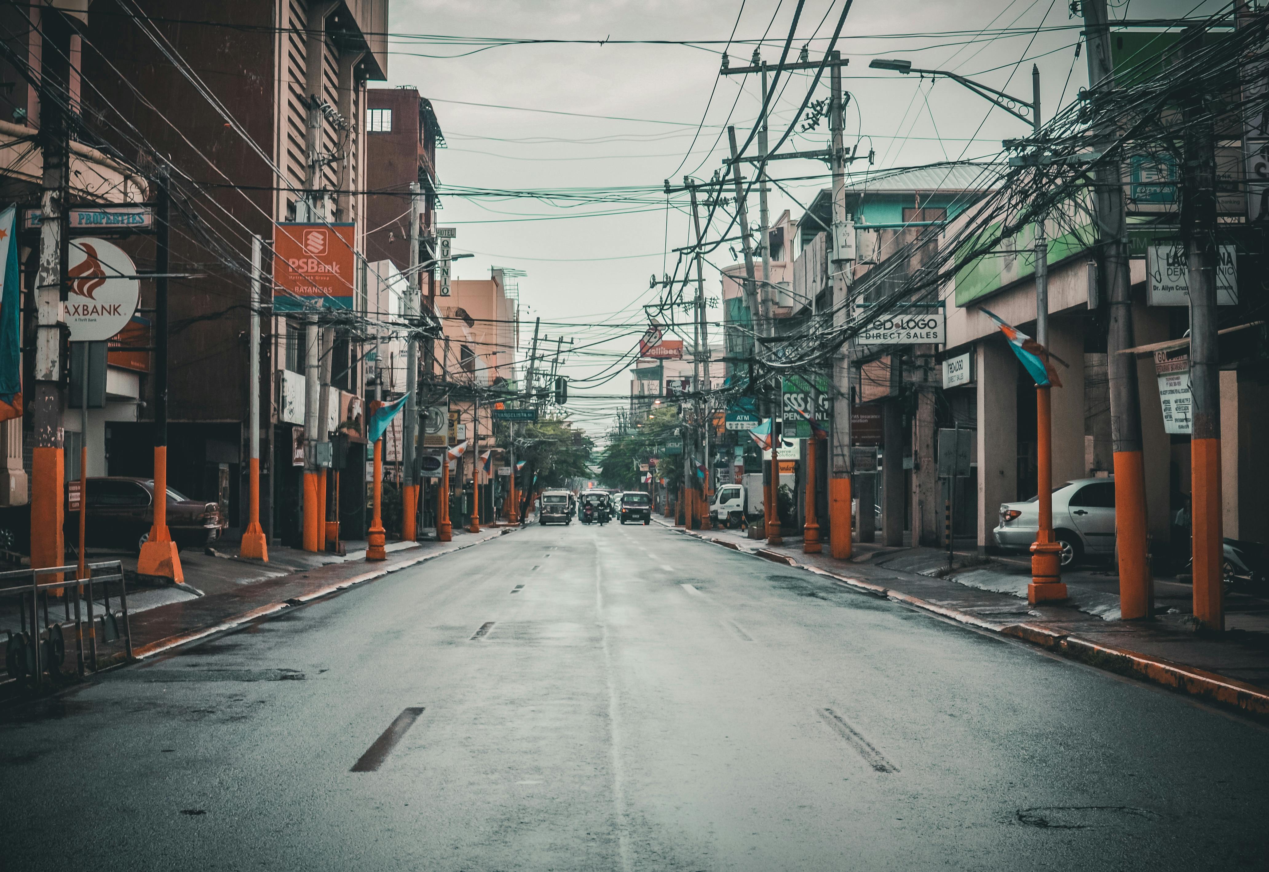 Empty street with wires and lanterns · Free Stock Photo