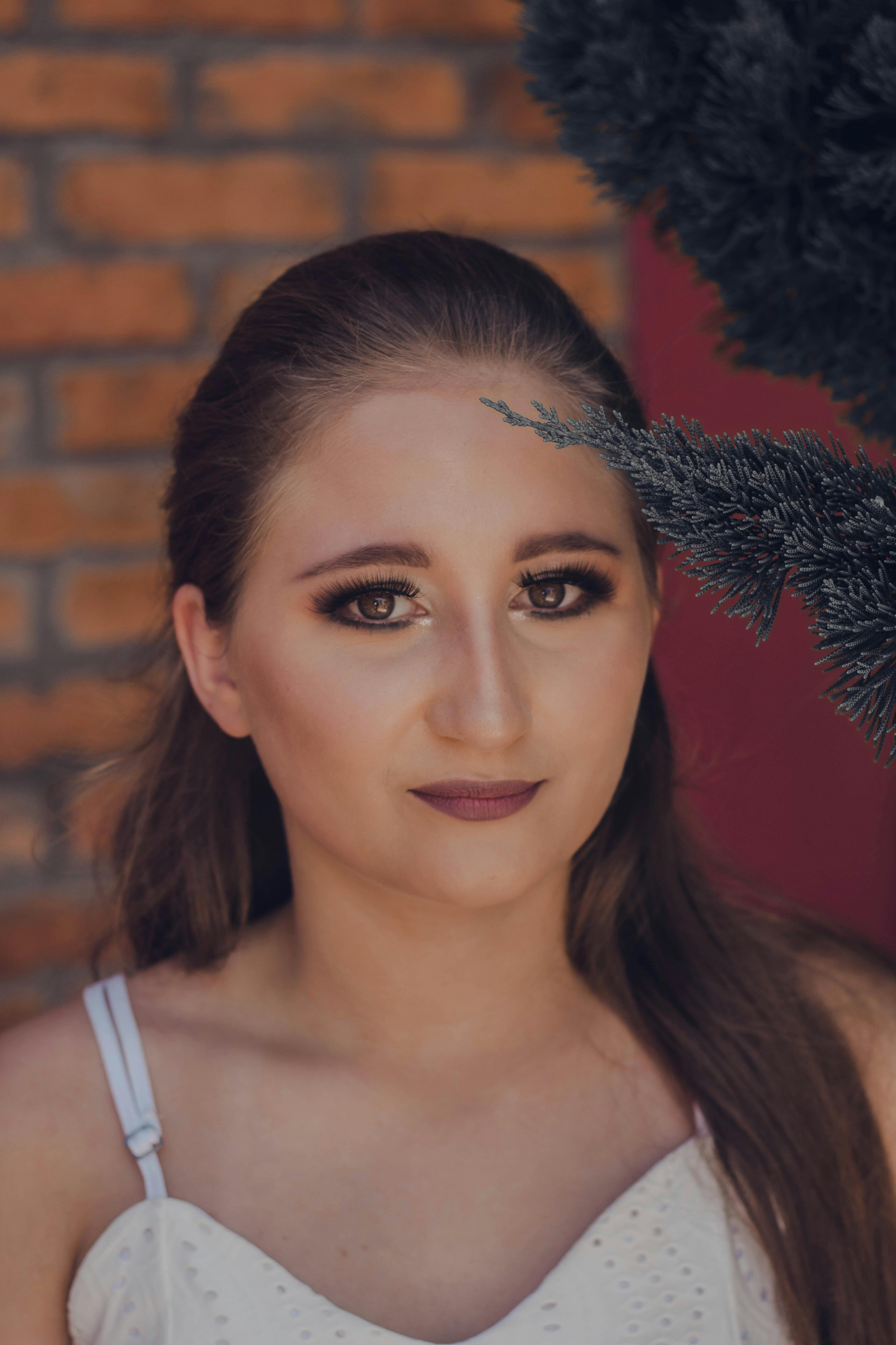 Trendy Asian woman with makeup and uncombed hair · Free Stock Photo