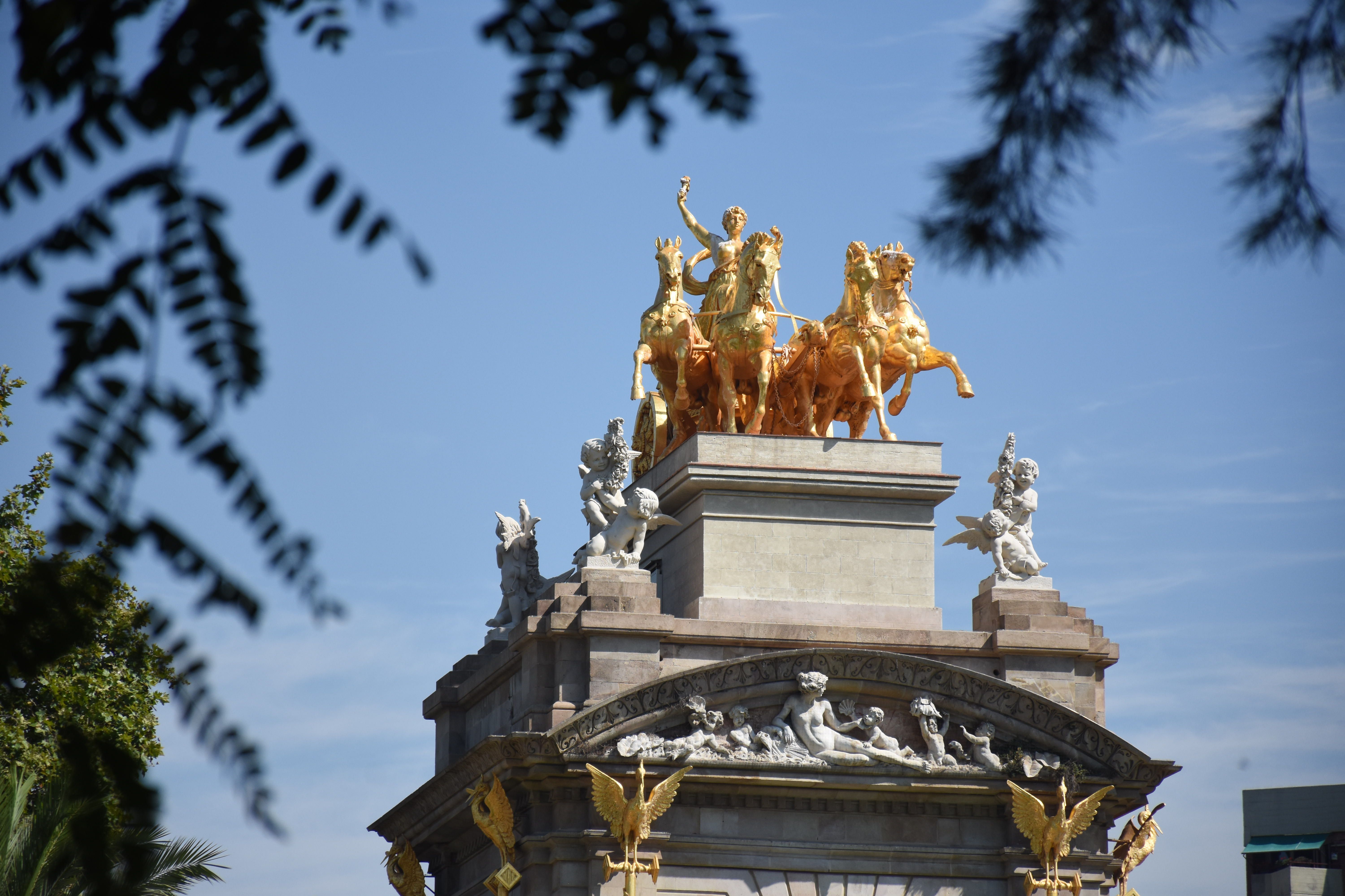 Monument located near trees under blue sky · Free Stock Photo