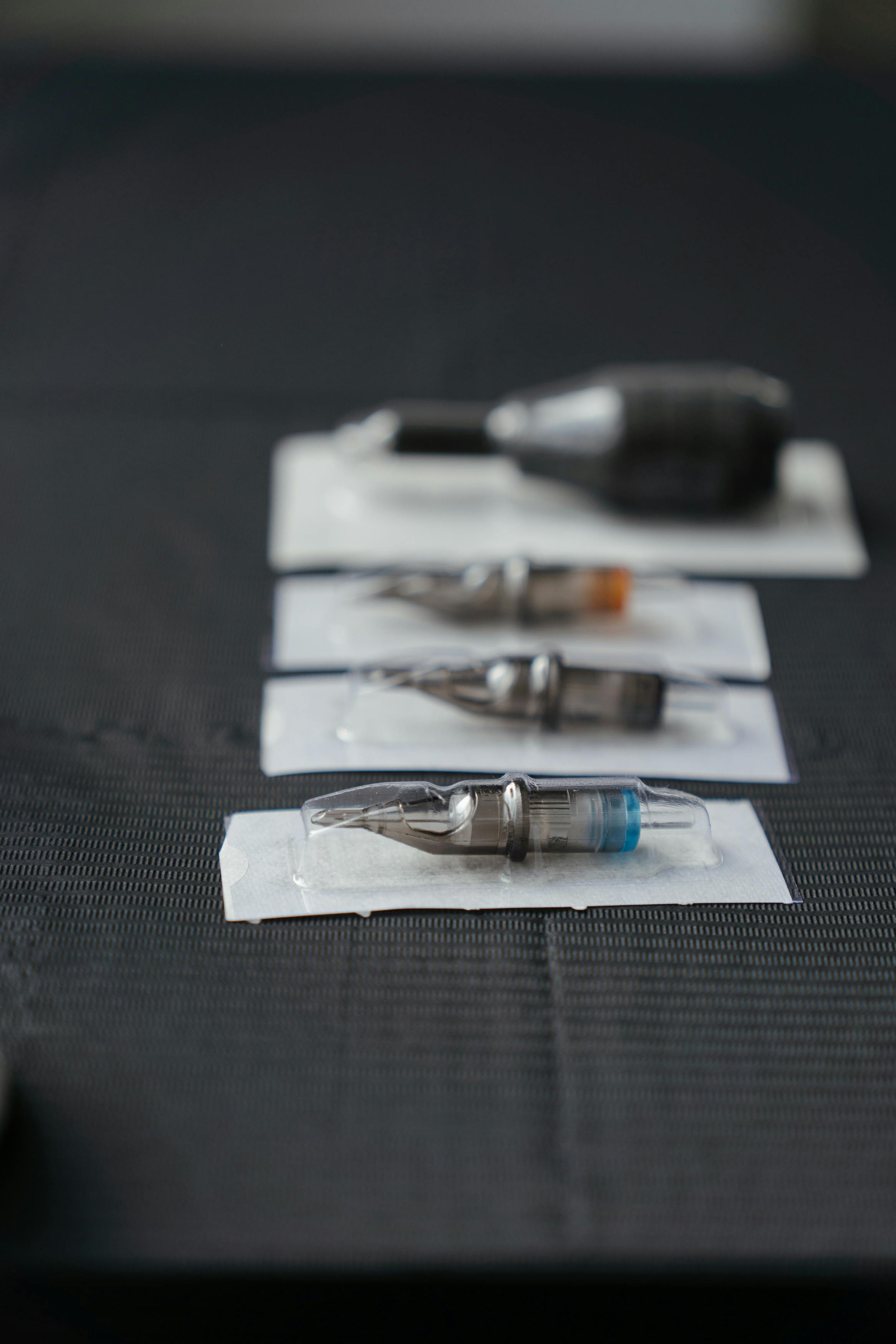 Close-up of an Tattoo Artist Putting Tattoos · Free Stock Photo