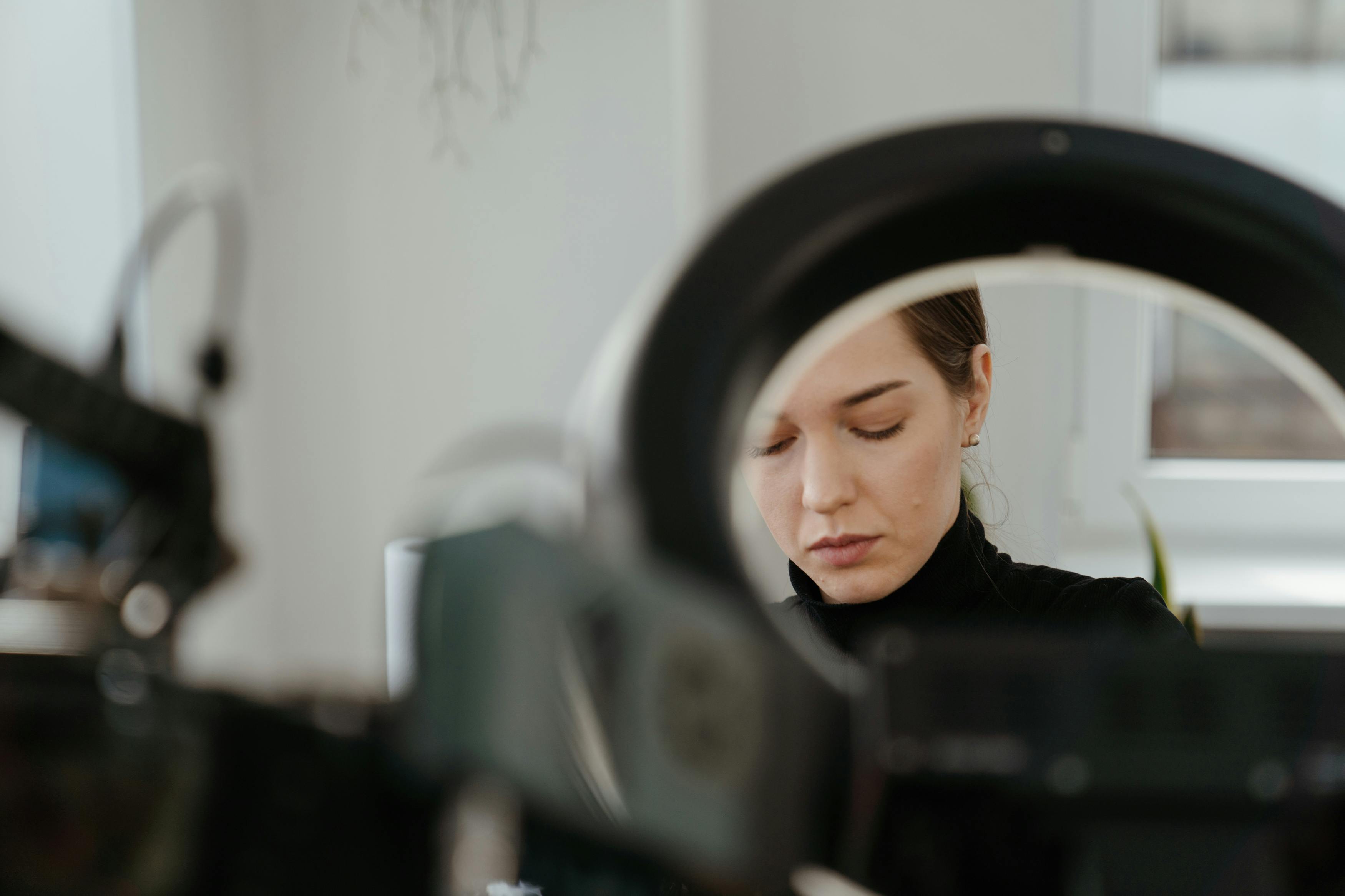 A Tattooed Man Holding a Clapperboard · Free Stock Photo