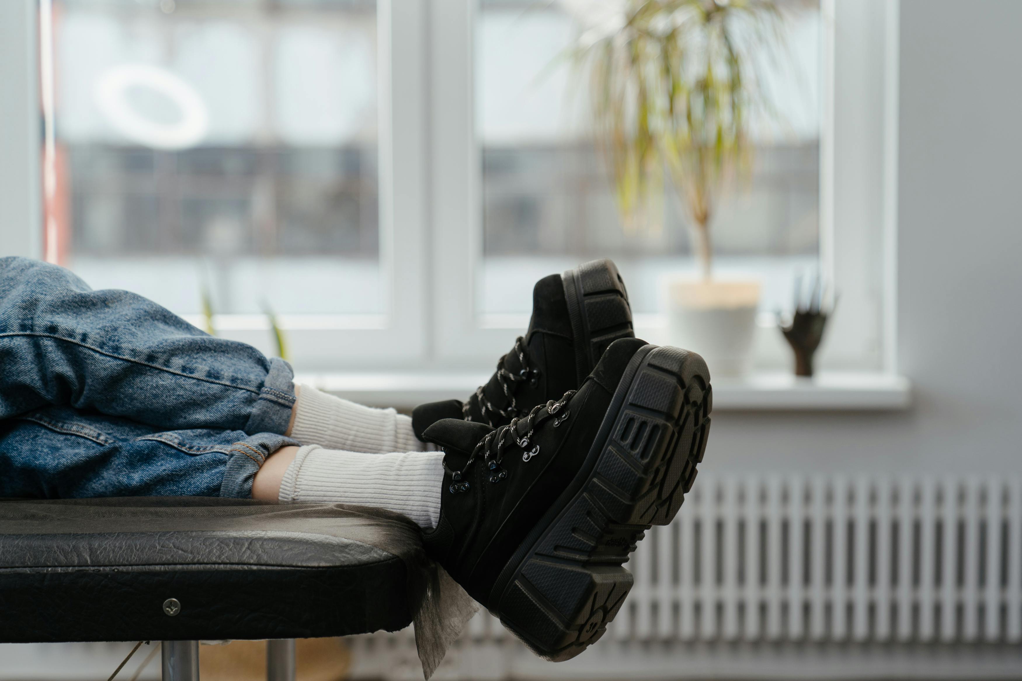 Person Wearing Black Nike Running Shoes · Free Stock Photo